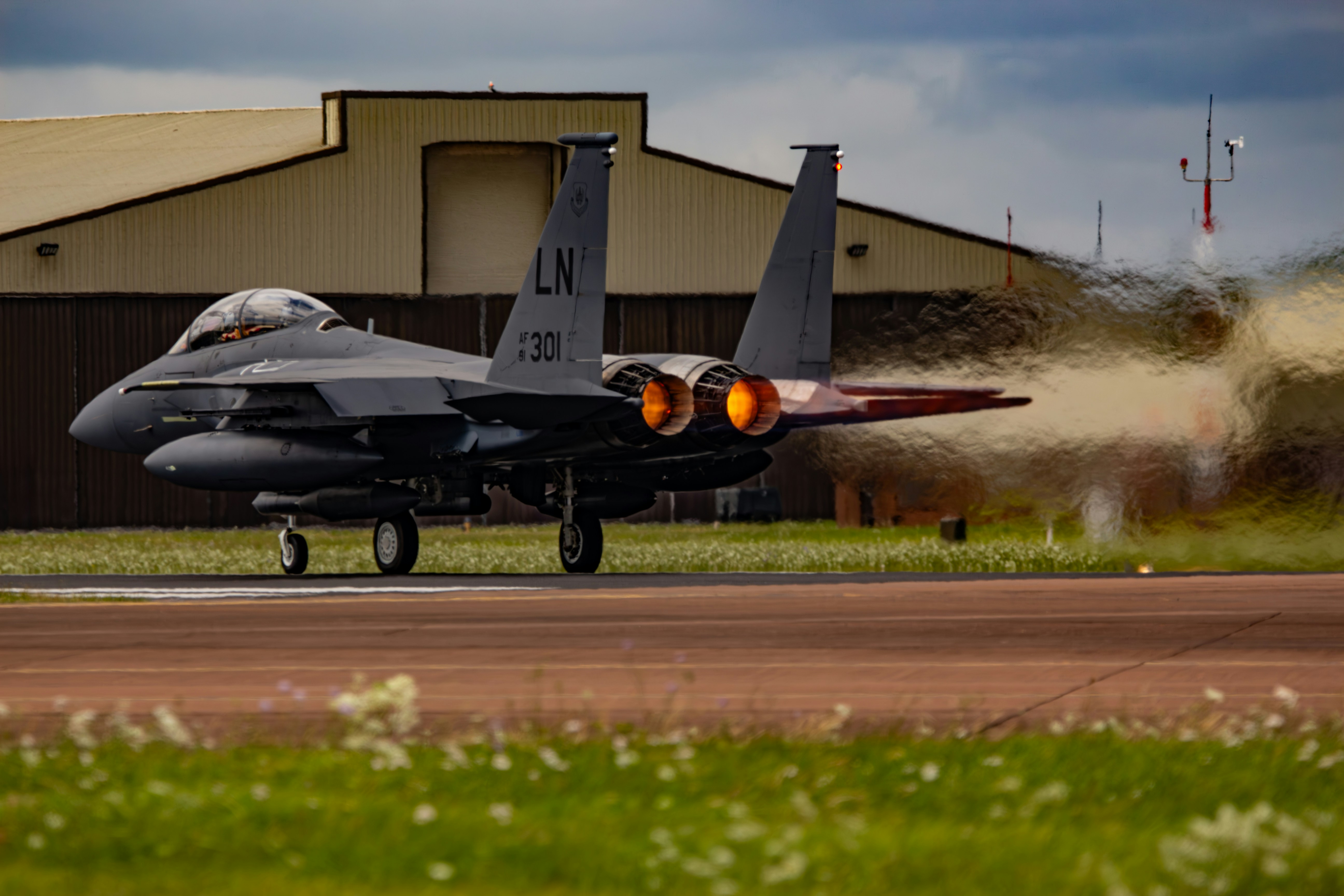 A fighter jet taking off from an airport runway photo – Free Aircraft ...