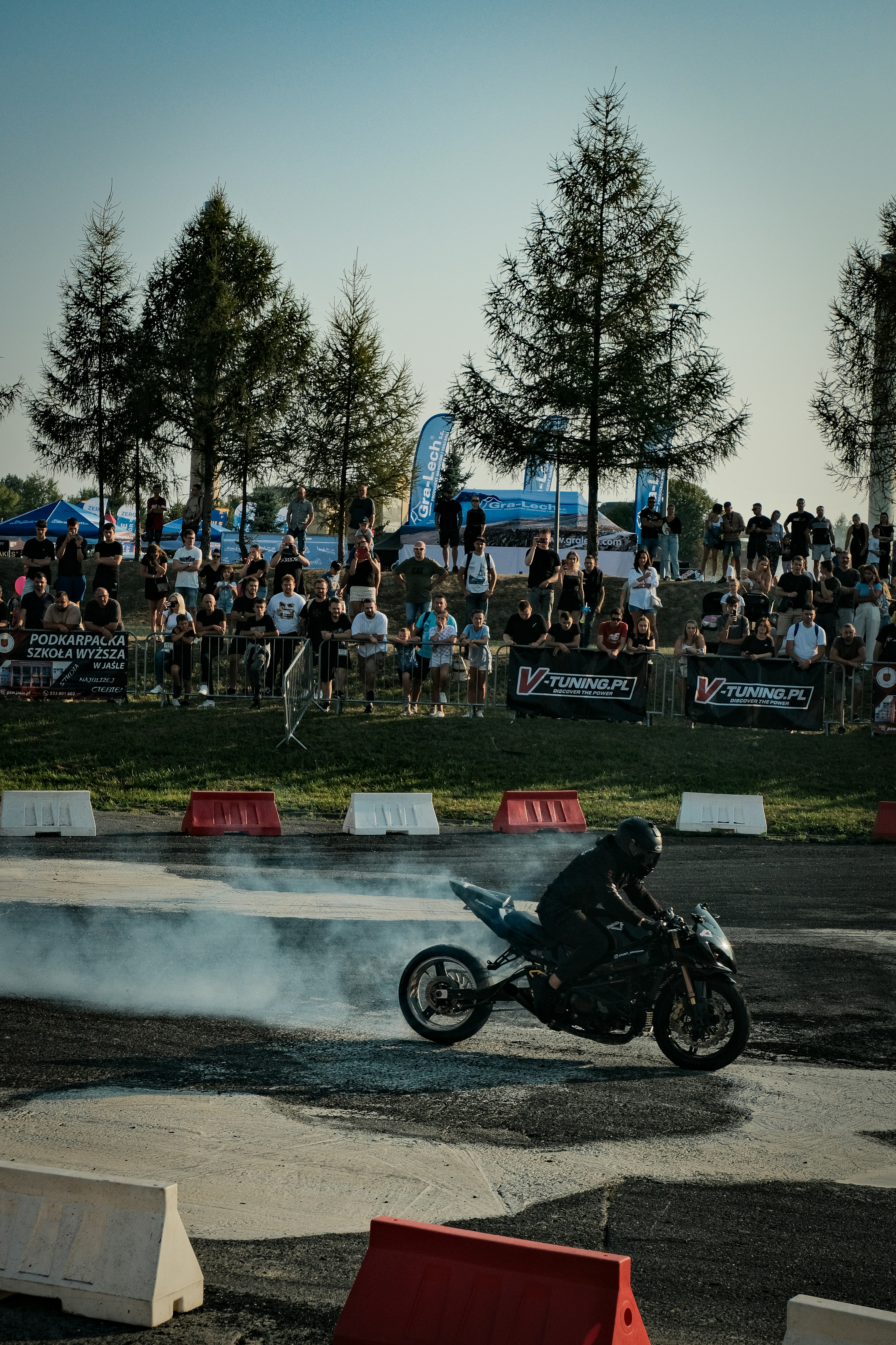 Crowdside Burnout: A Moto Drift Under Open Sky