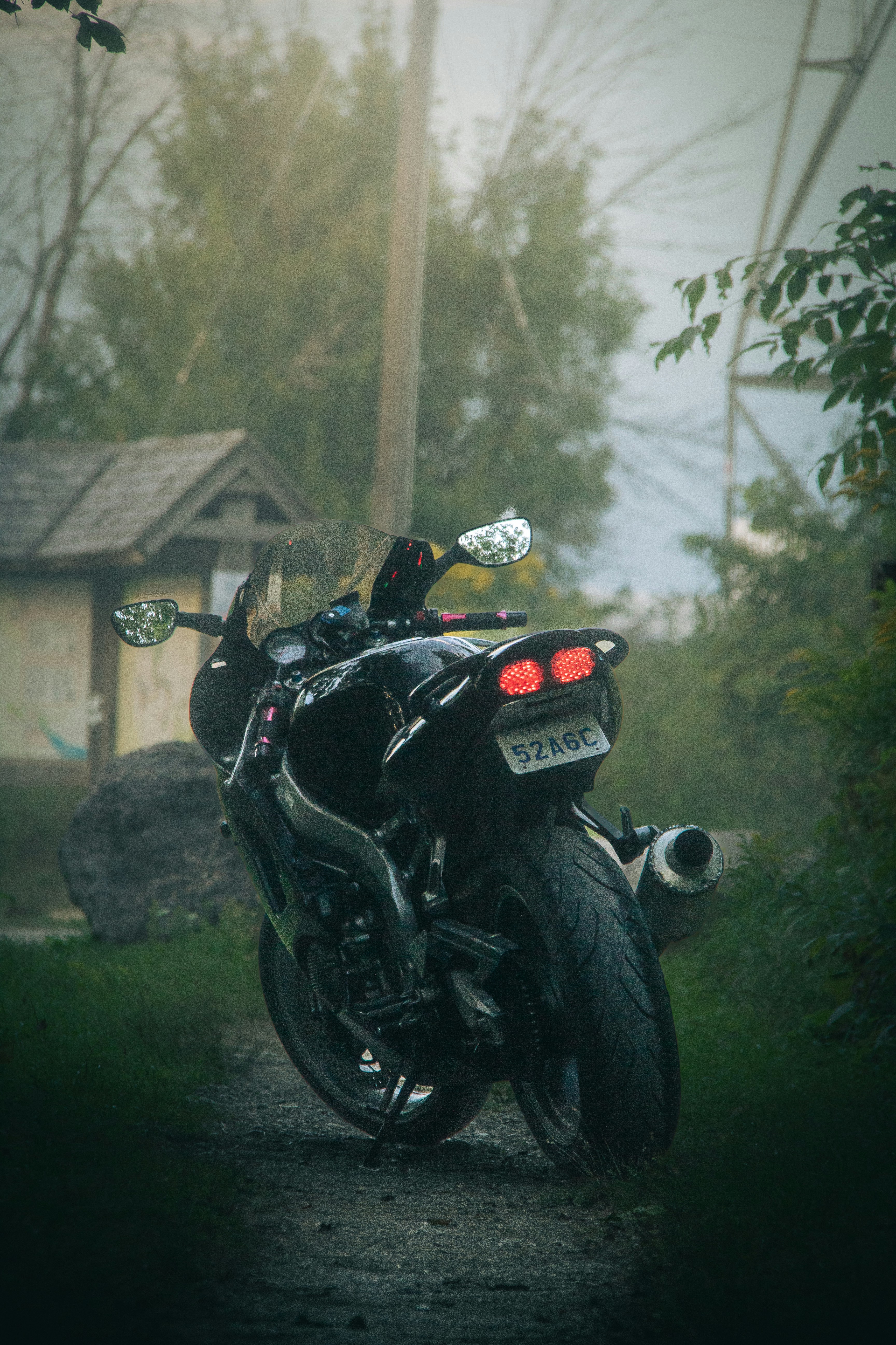 Midnight Chrome Resting on a Secluded Gravel Lane