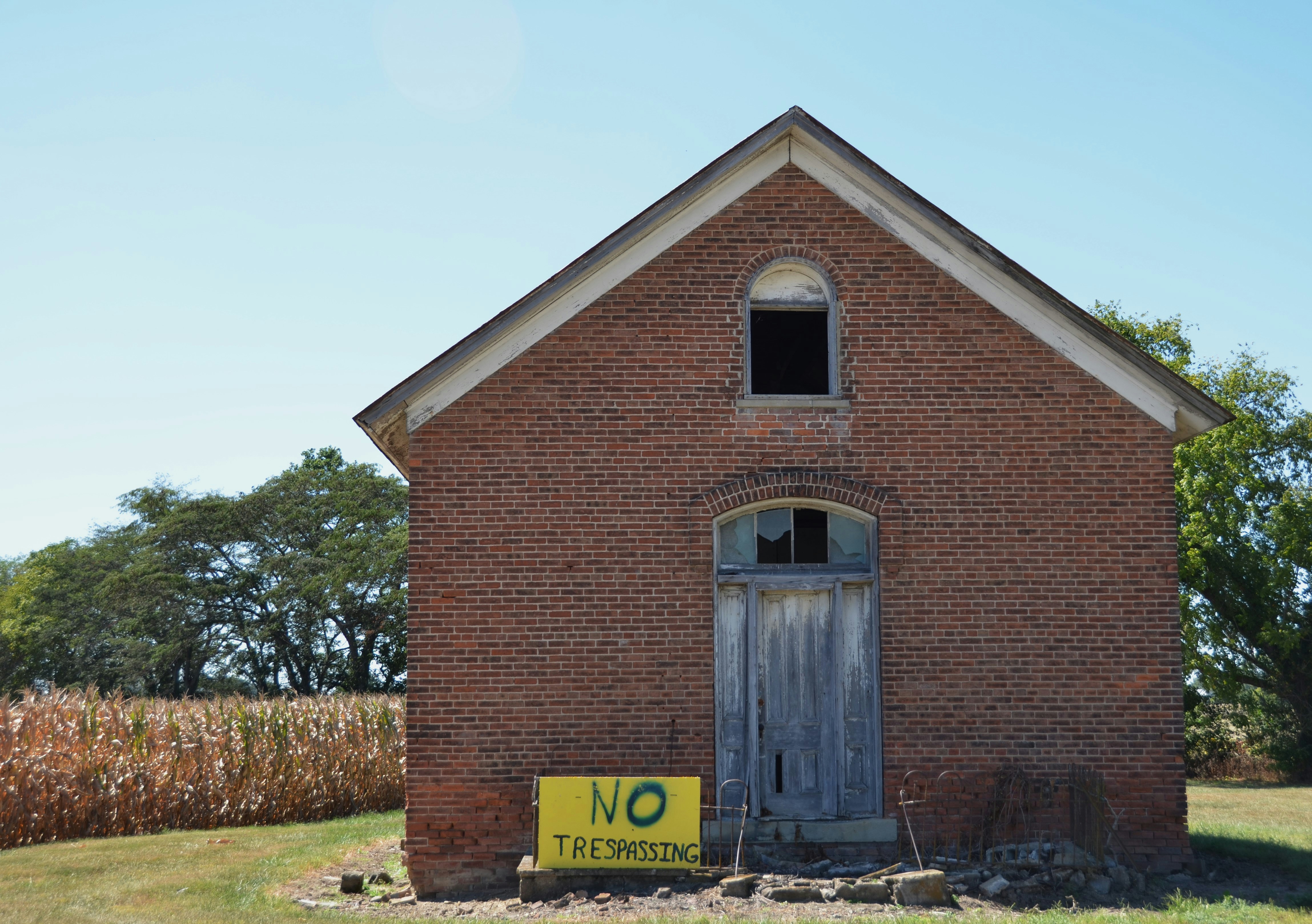 Abandoned Brick Chapel Beside a Field of Corn