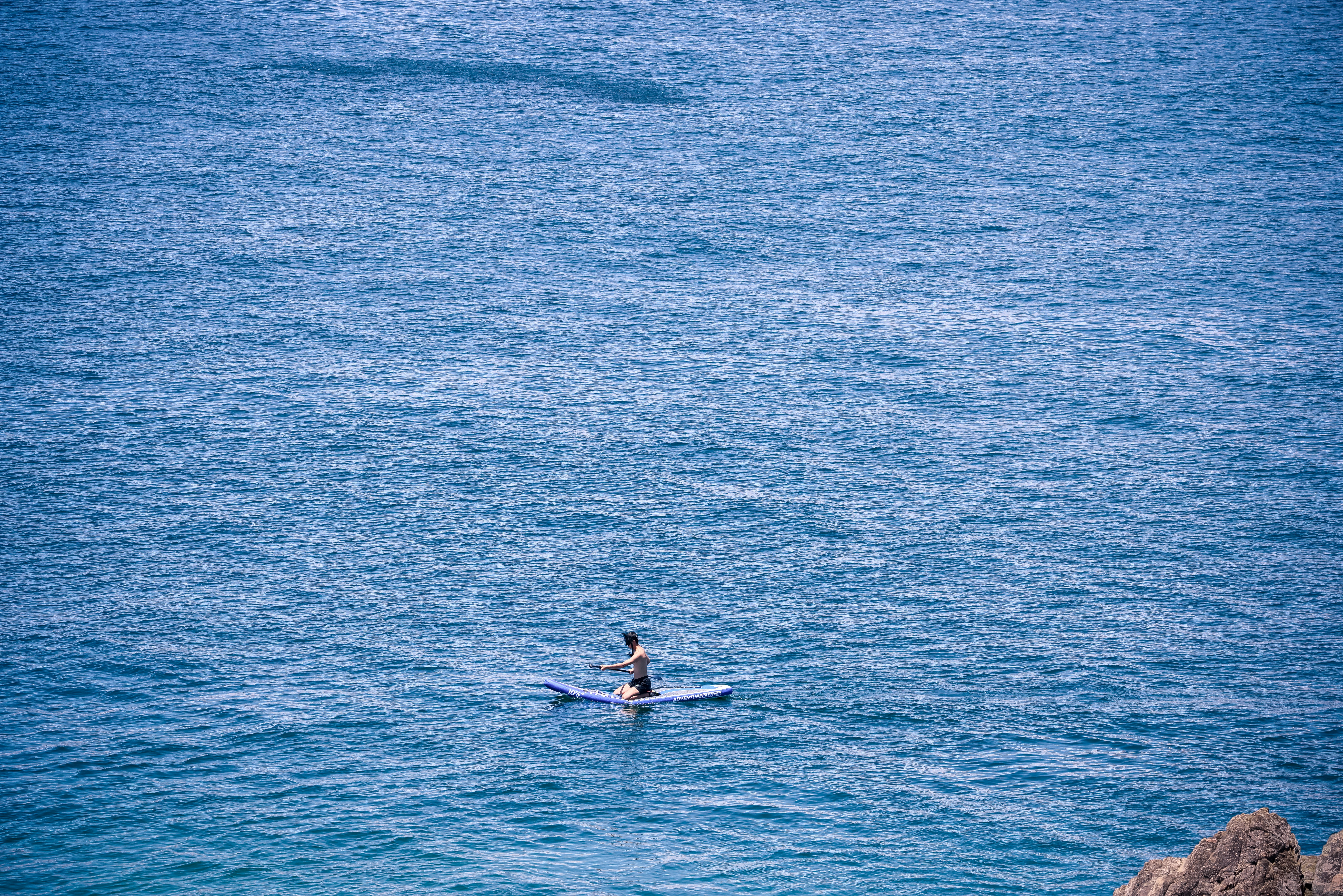 A person on a surfboard in the middle of the ocean photo – Free Human ...