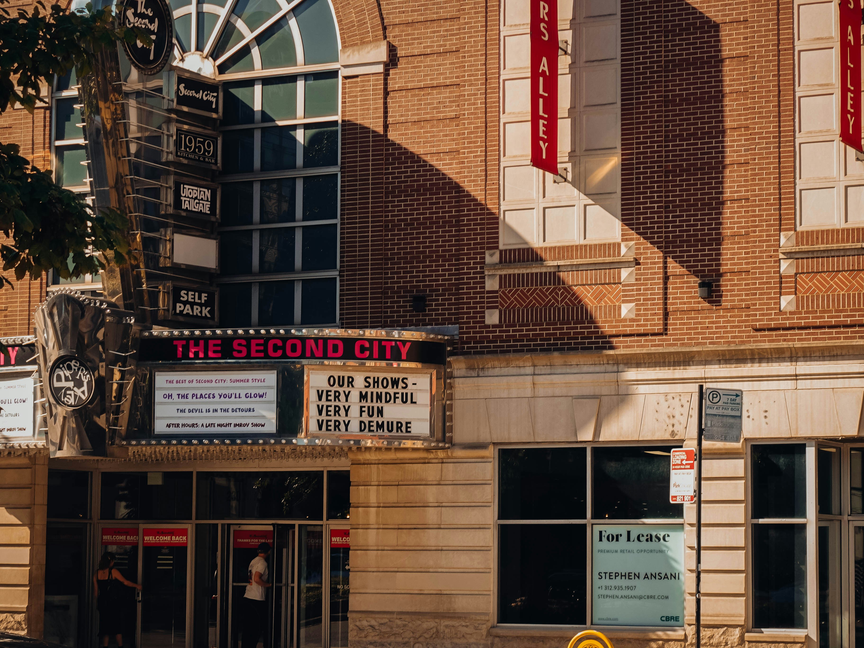 A building that has a bunch of signs on it photo – Free Urban Image on ...