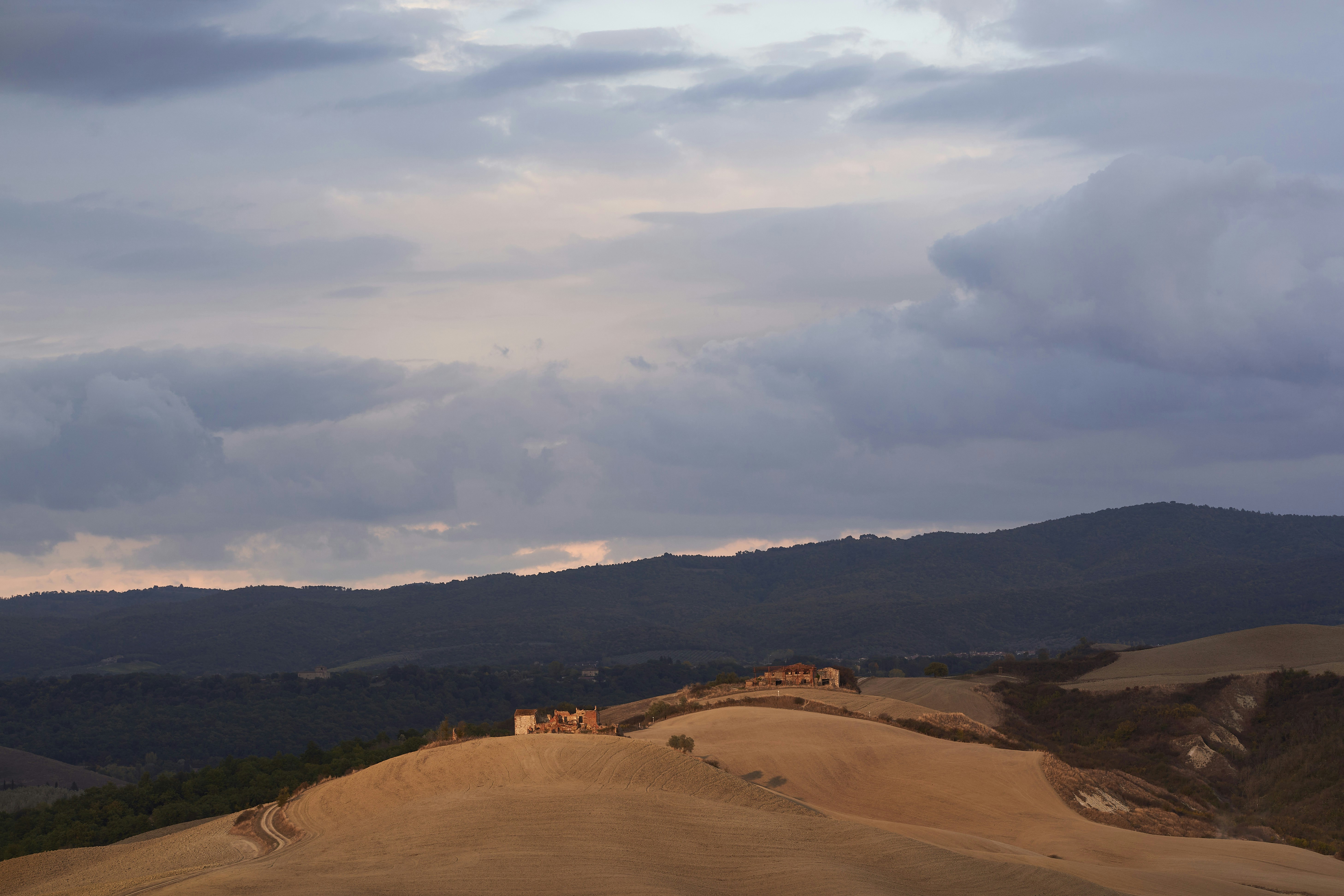 A view of a hill with hills in the background photo – Free Nature Image ...