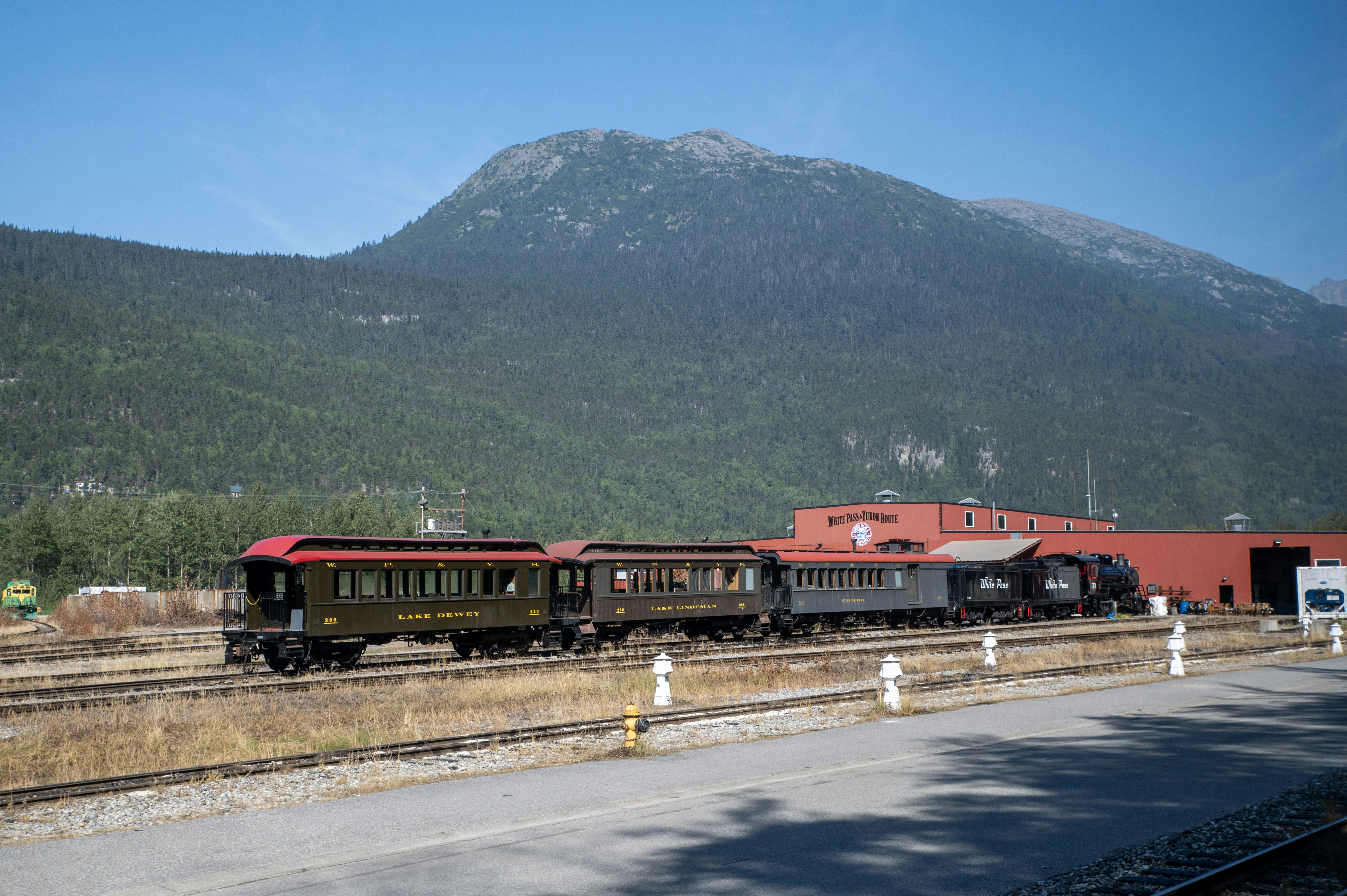 Steam Locomotive Against Majestic Mountain Backdrop