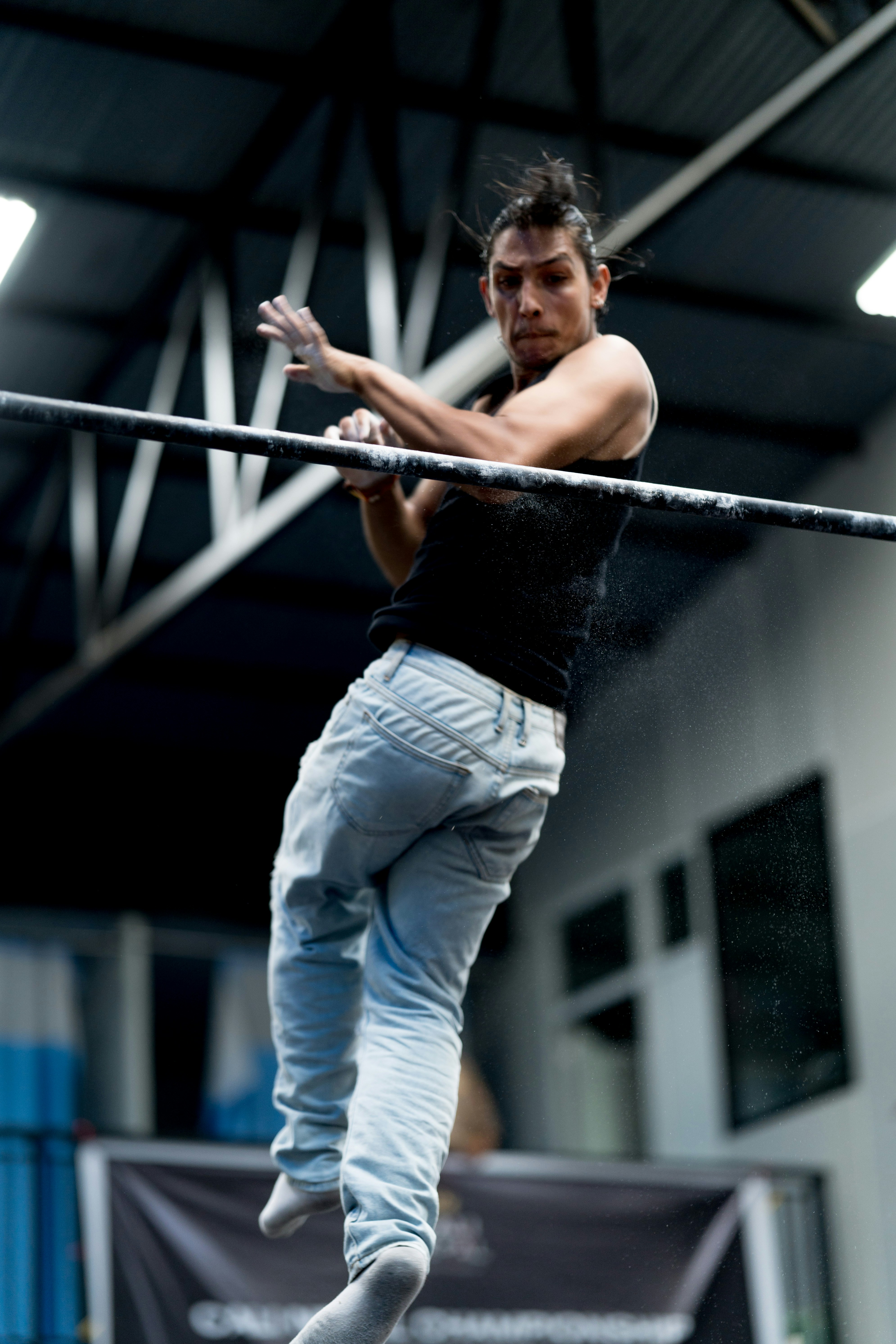 A man holding a pole in a gym photo – Free Image on Unsplash