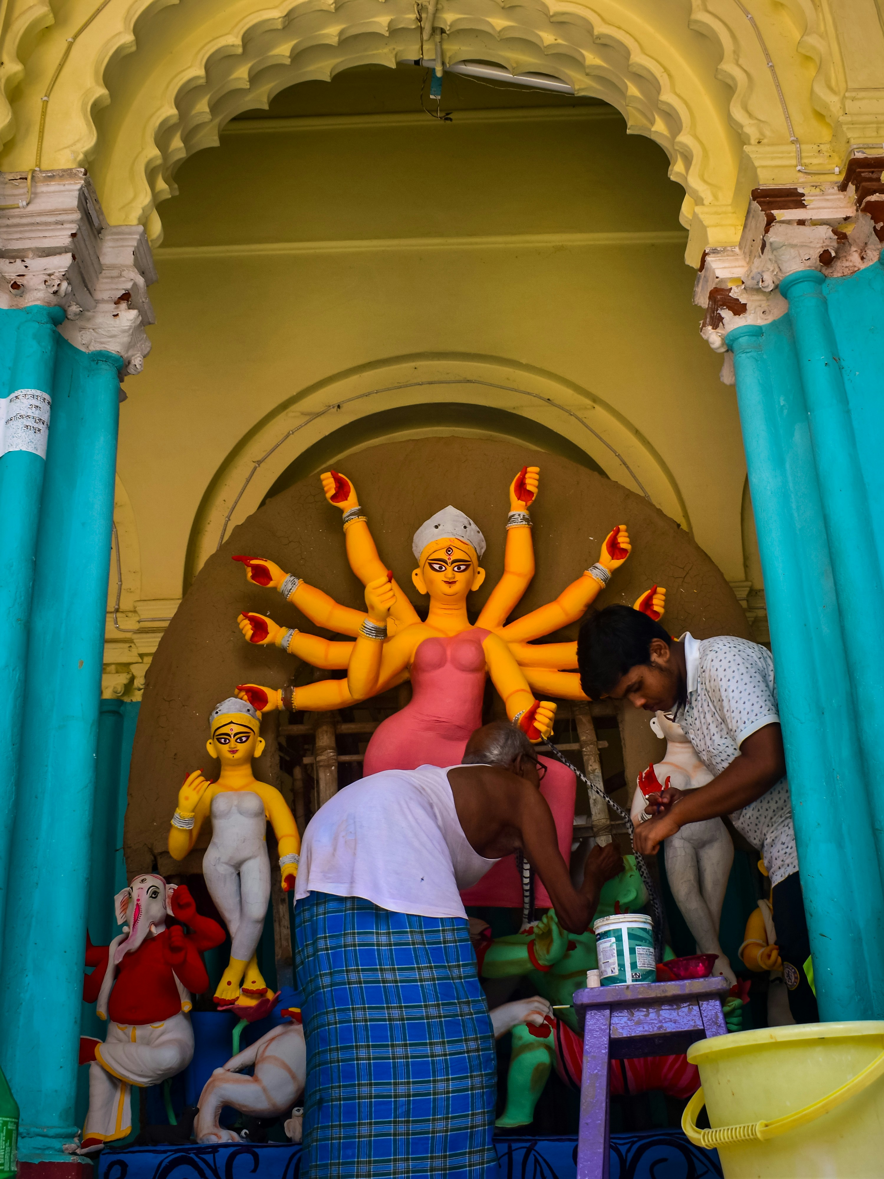 A statue of a woman surrounded by other statues photo – Free Hindu god ...