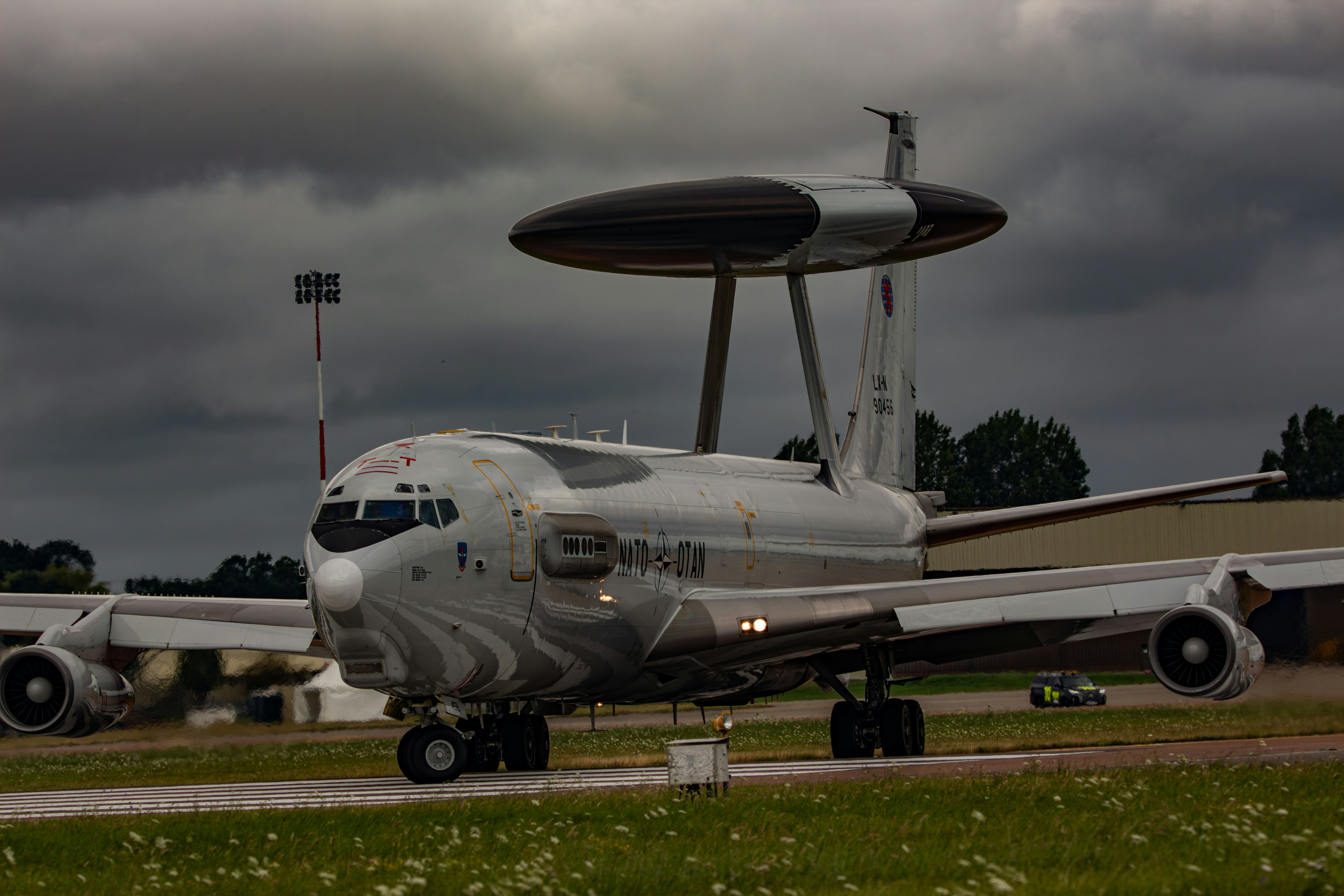 Grounded Giant Under Stormy Skies: Cargo Jet with Rooftop Radar Dome
