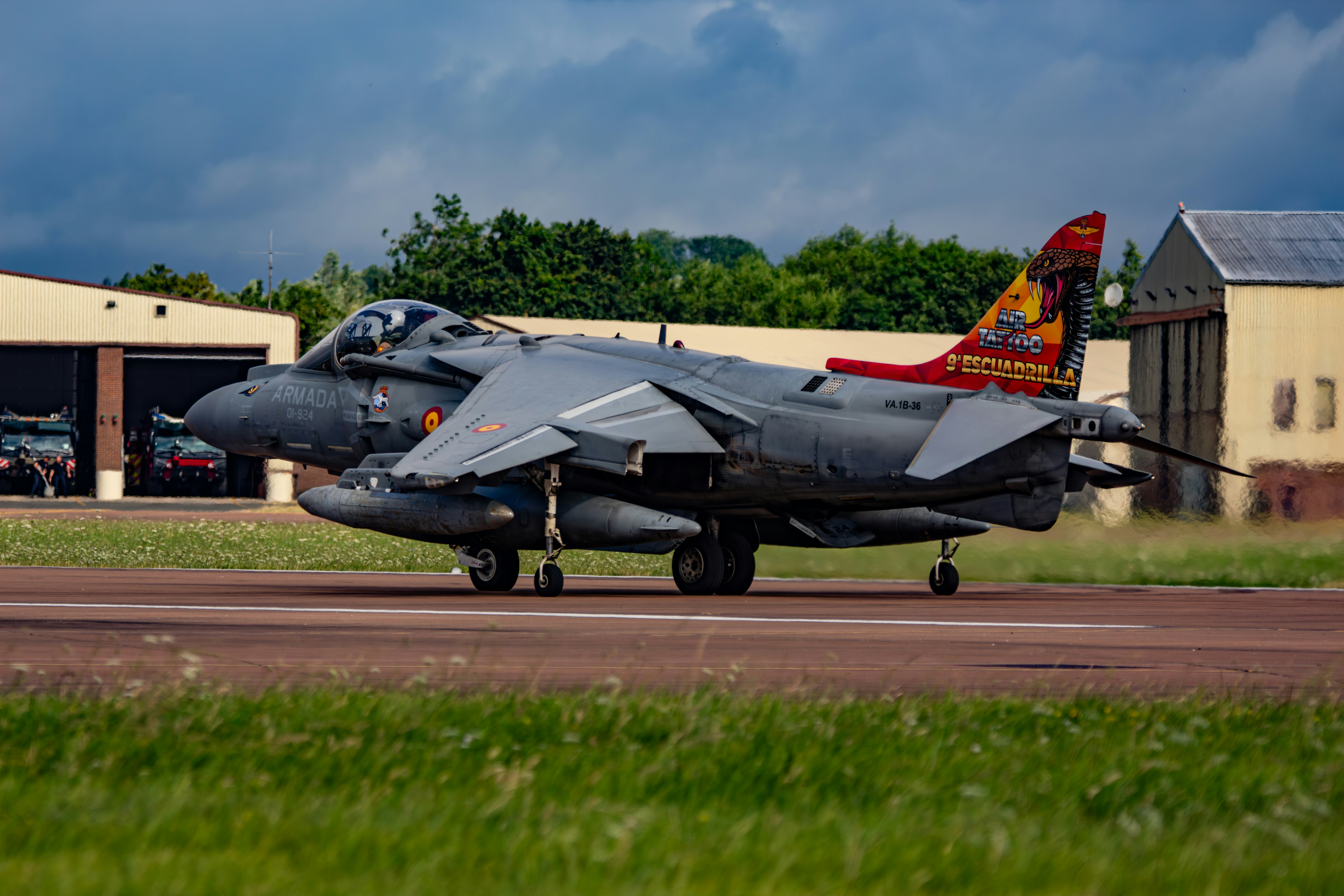A fighter jet sitting on top of an airport runway photo – Free Airfield ...