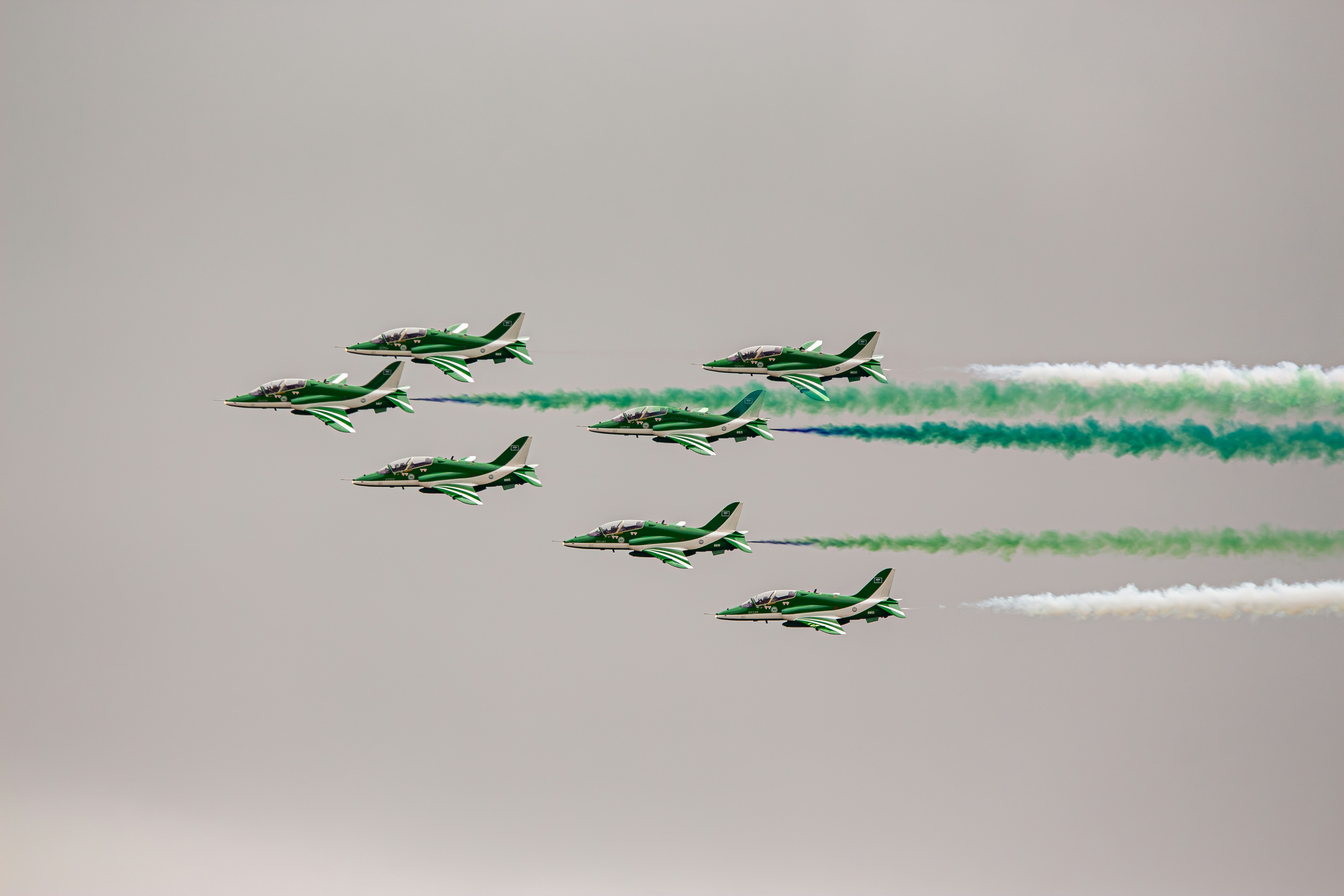 A group of jets flying through a cloudy sky photo – Free Animal Image ...