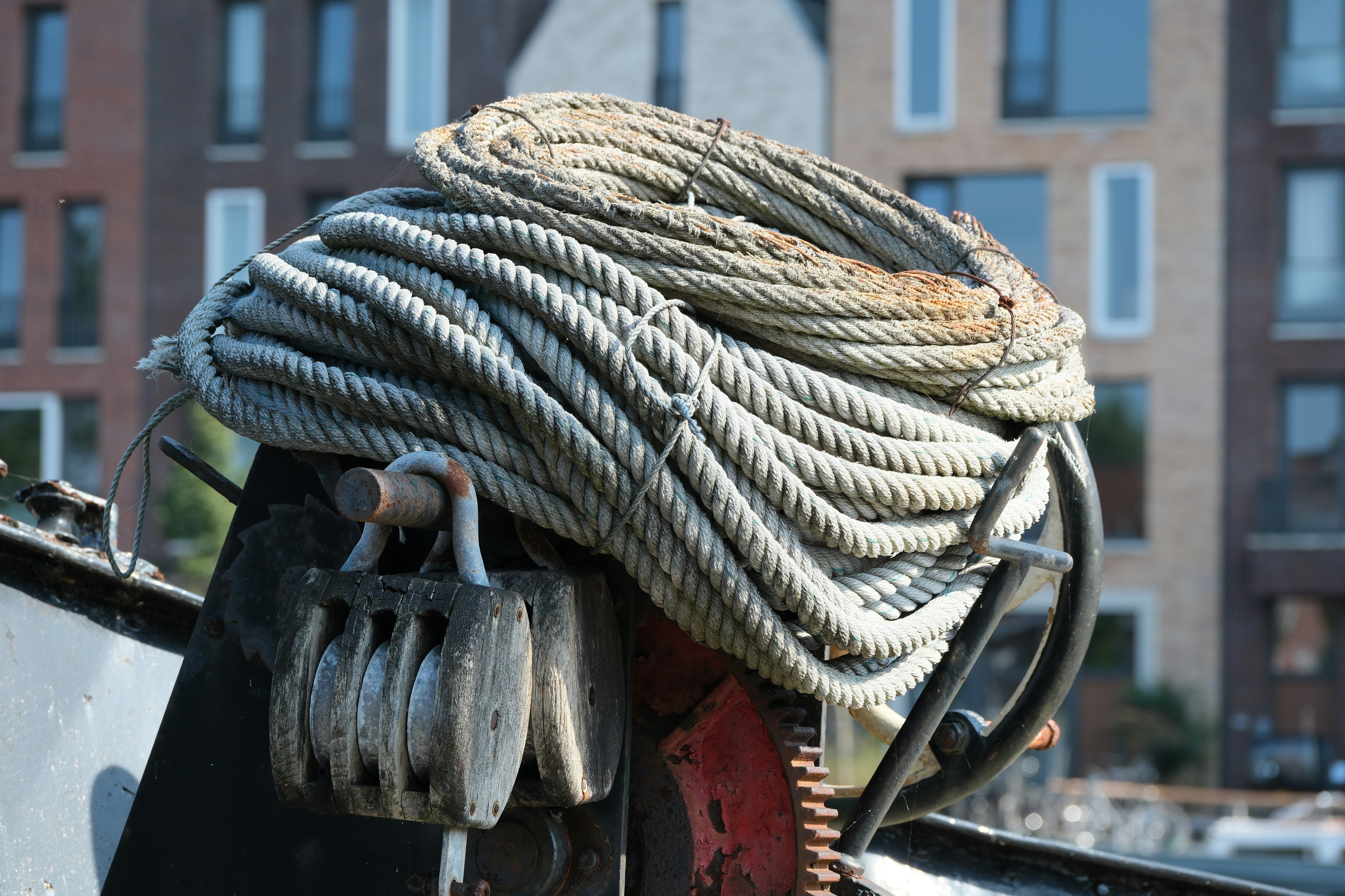 Tangled Lines and Urban Backdrop: Coiled Rope on Industrial Machinery