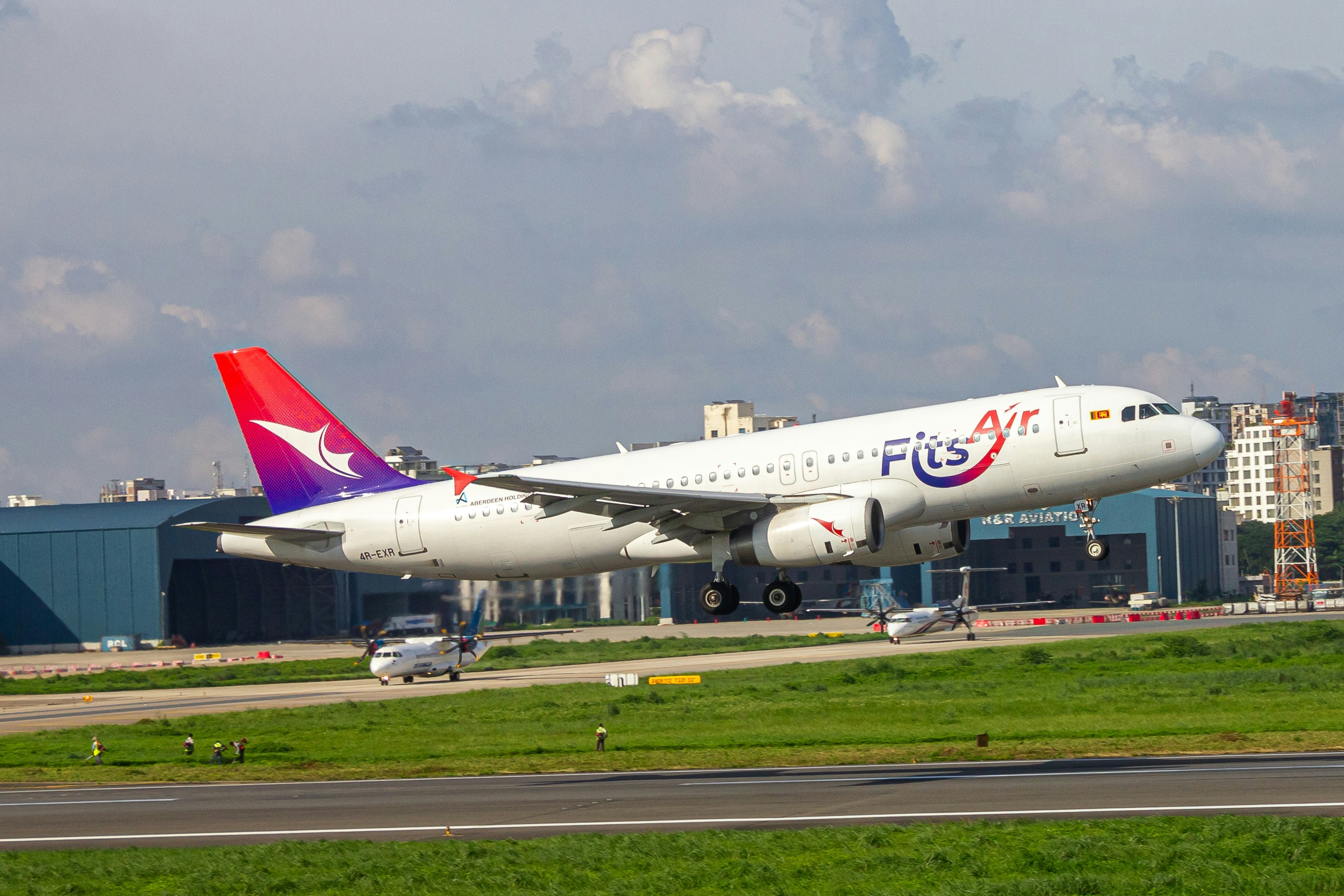 A large jetliner sitting on top of an airport runway photo – Free ...