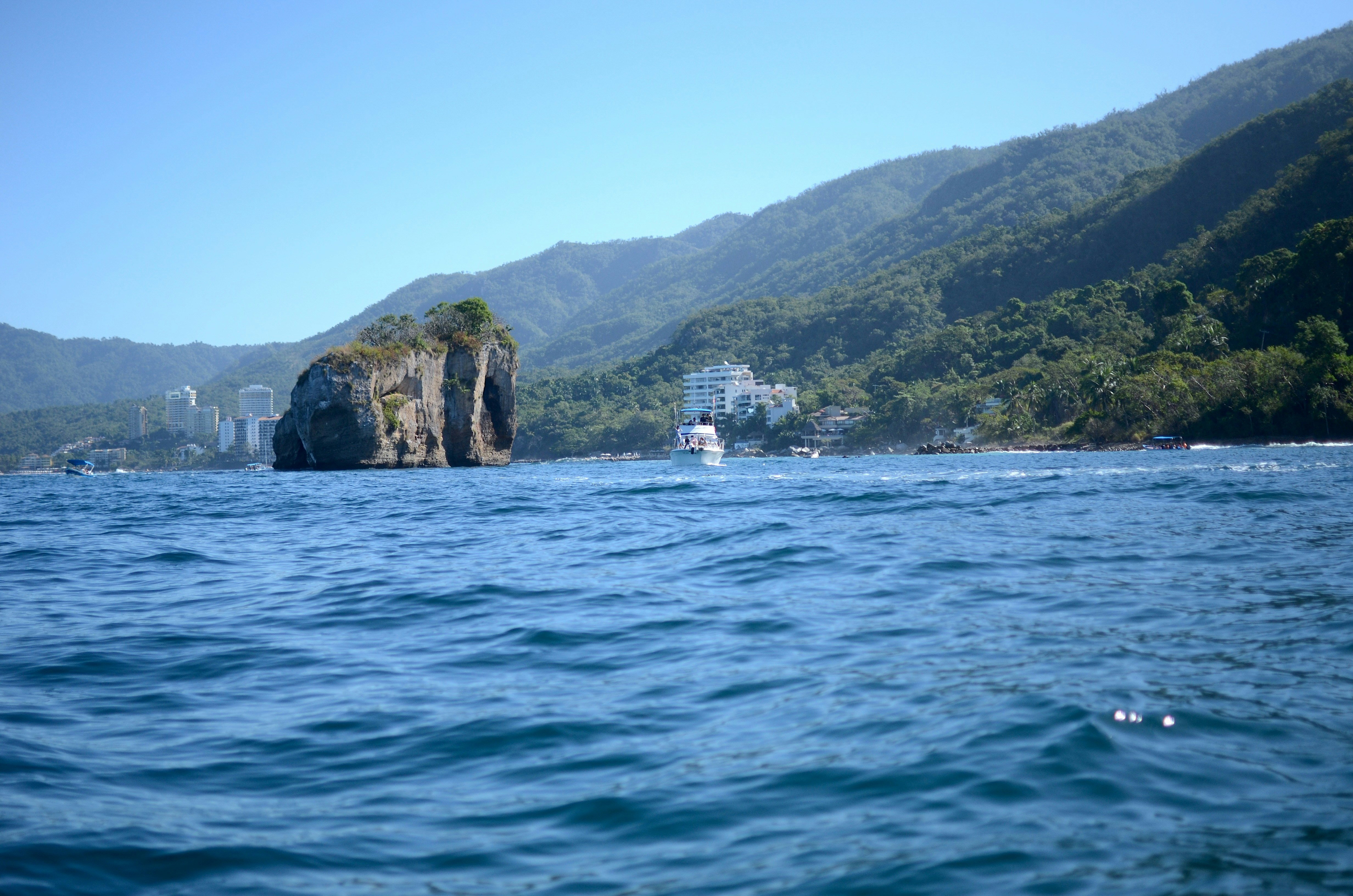 Coastal Portal: A Lone Rock Isle Framed by the Sea