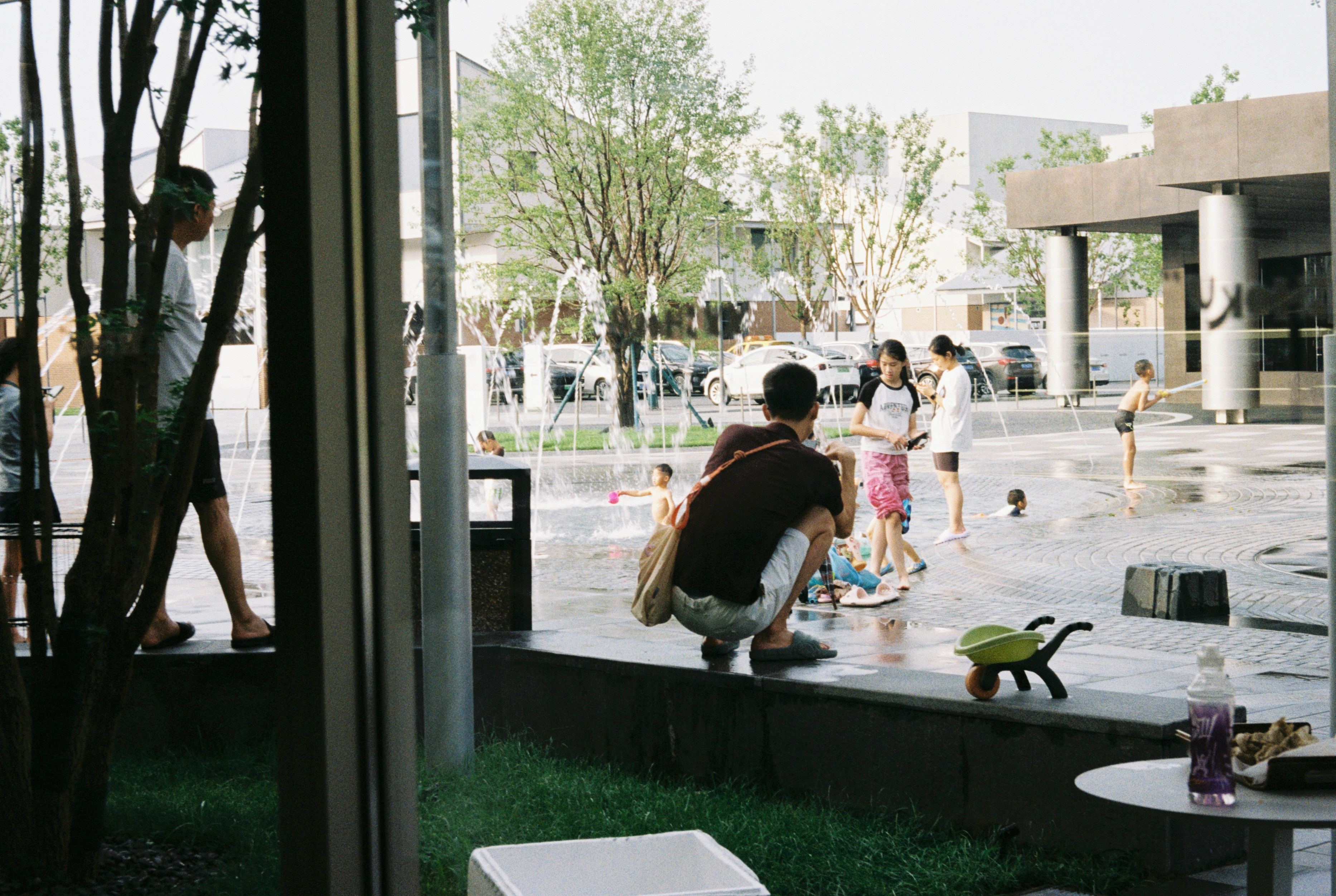 A group of people standing outside of a building photo – Free Car Image ...