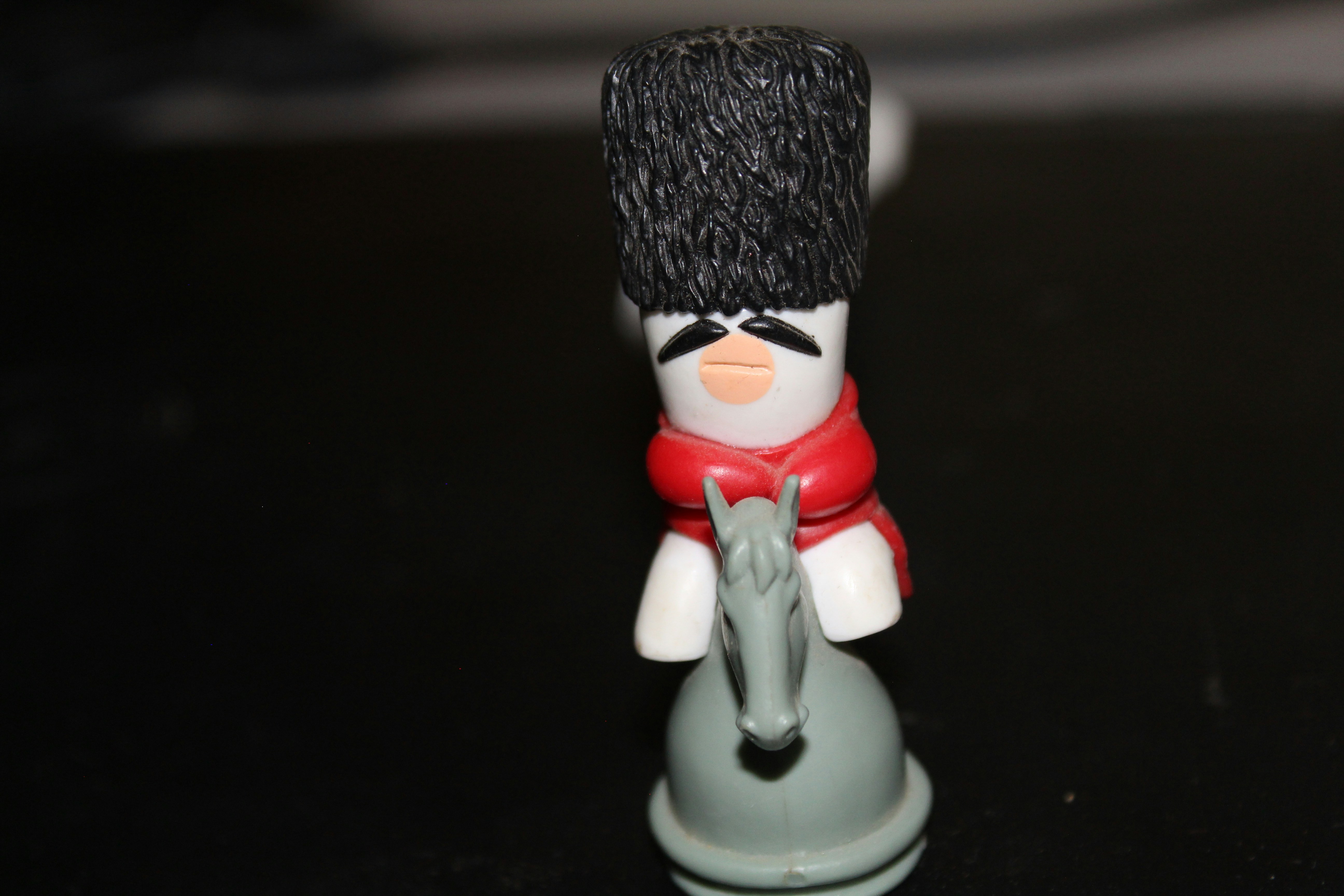 A Tiny Nutcracker Guard: Ceramic Knight in Soft Focus