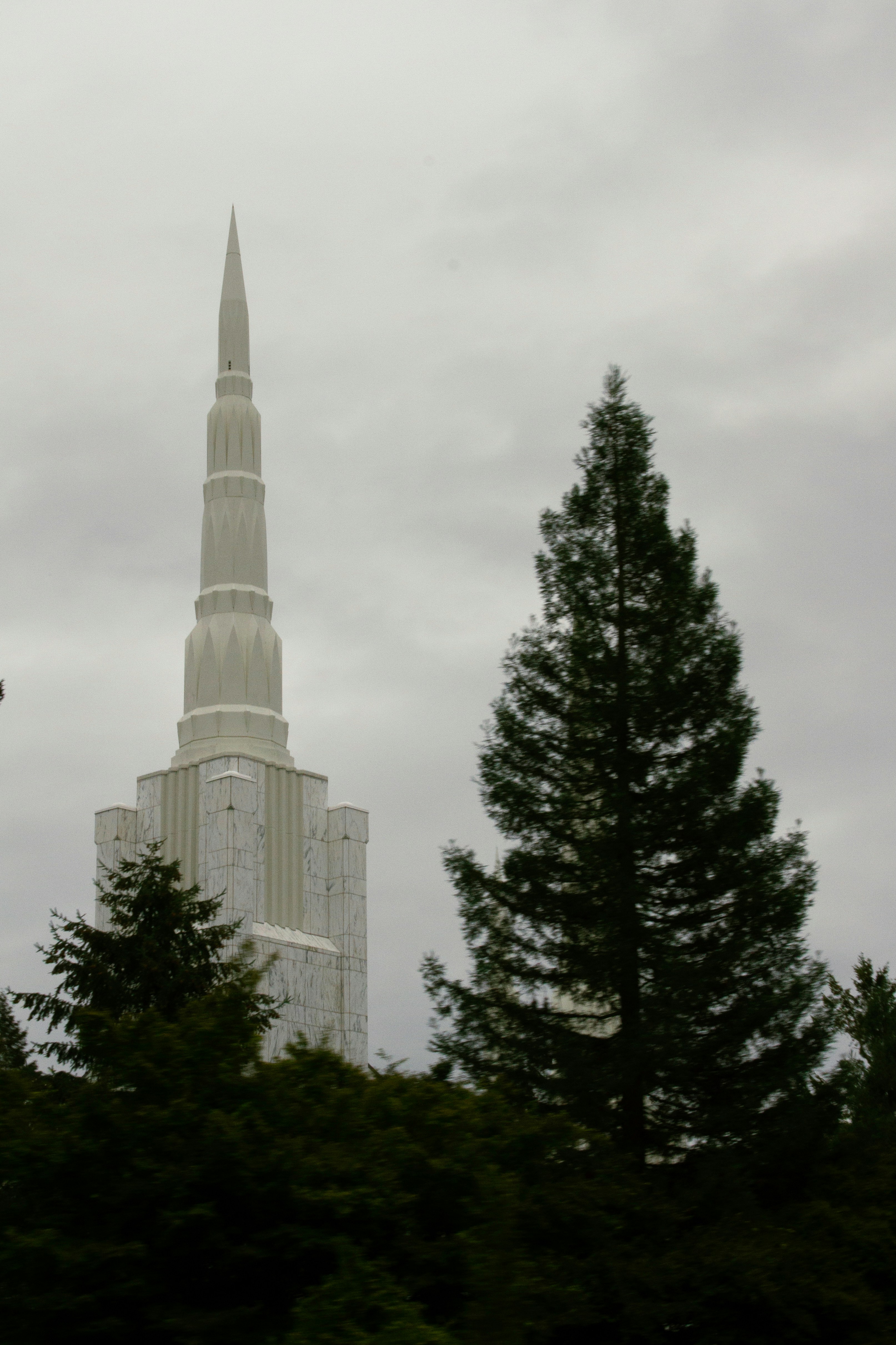 A tall white building with a steeple in the background photo – Free ...