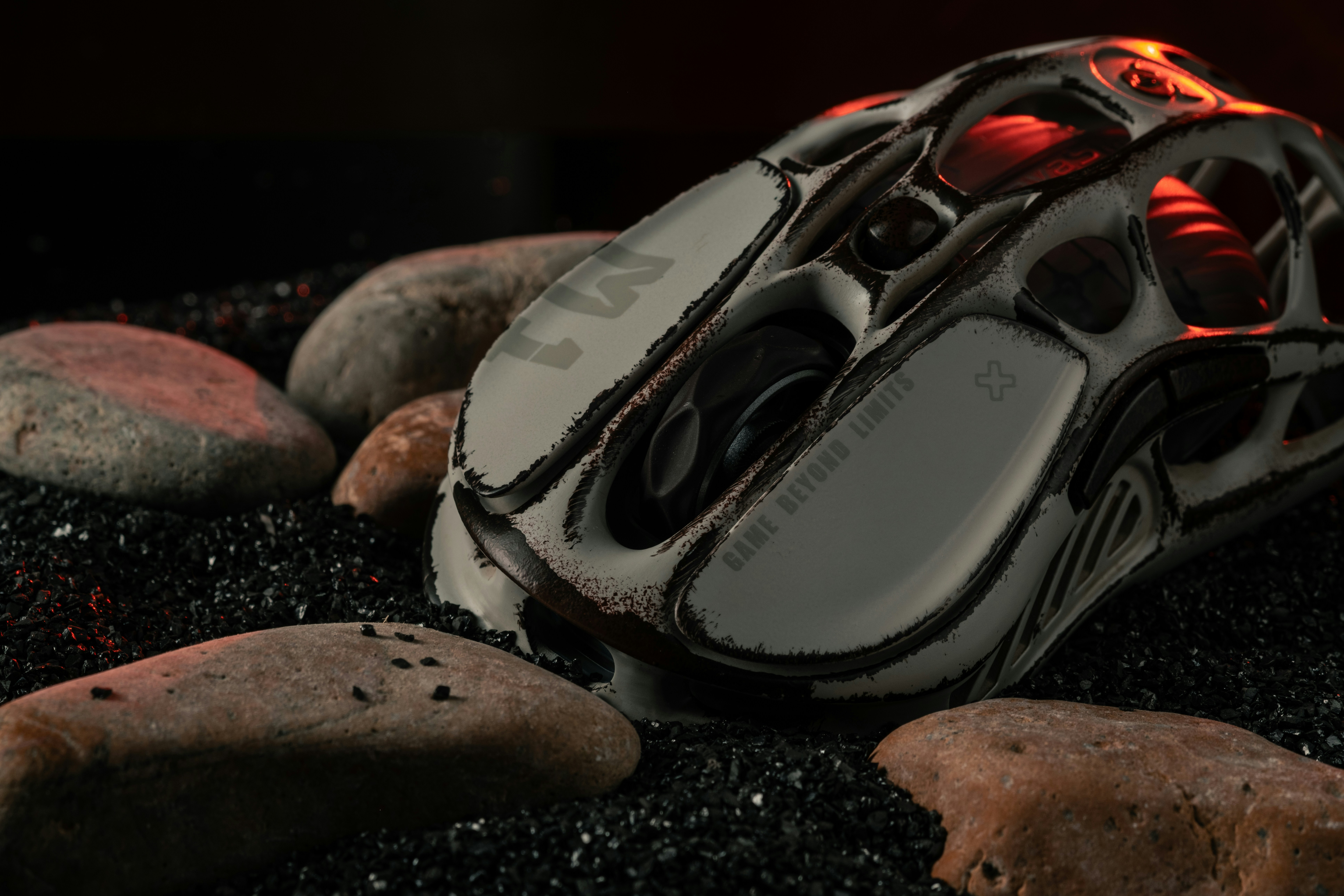 A computer mouse sitting on top of a pile of rocks photo – Free Gamming ...