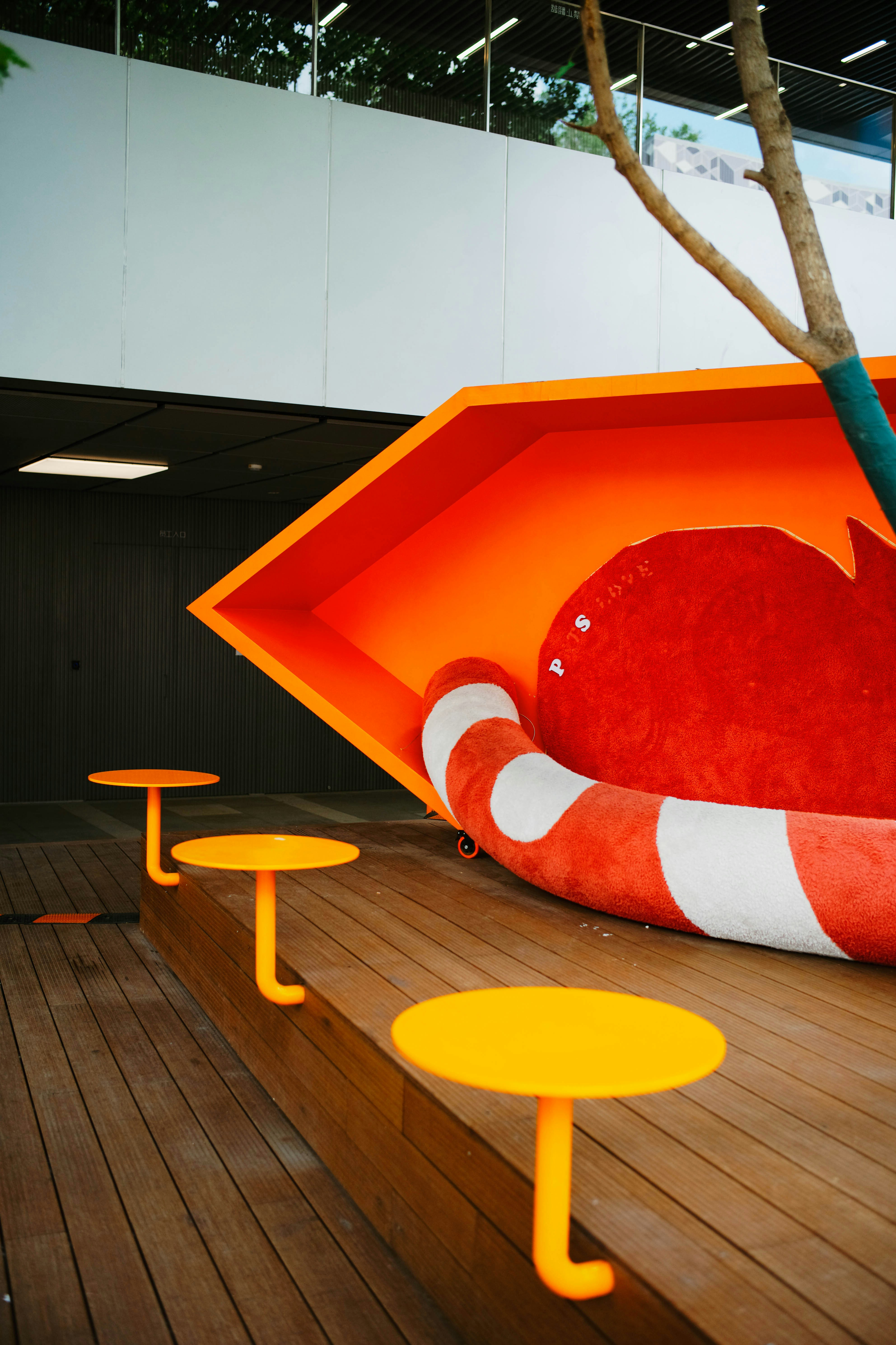 Orange Wedge Shelter Cradling a Striped Plush Heart