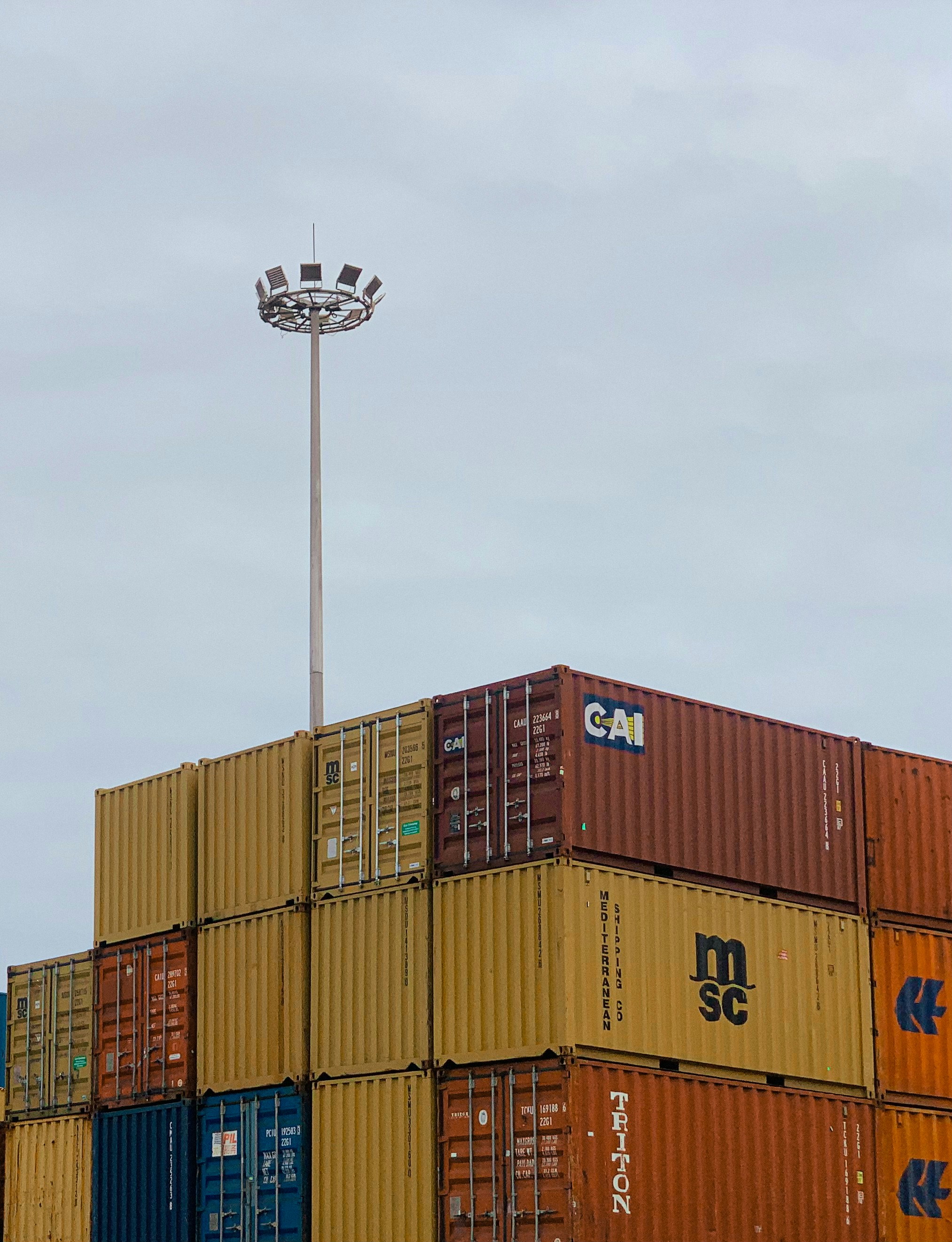 A large stack of shipping containers sitting on top of each other photo ...