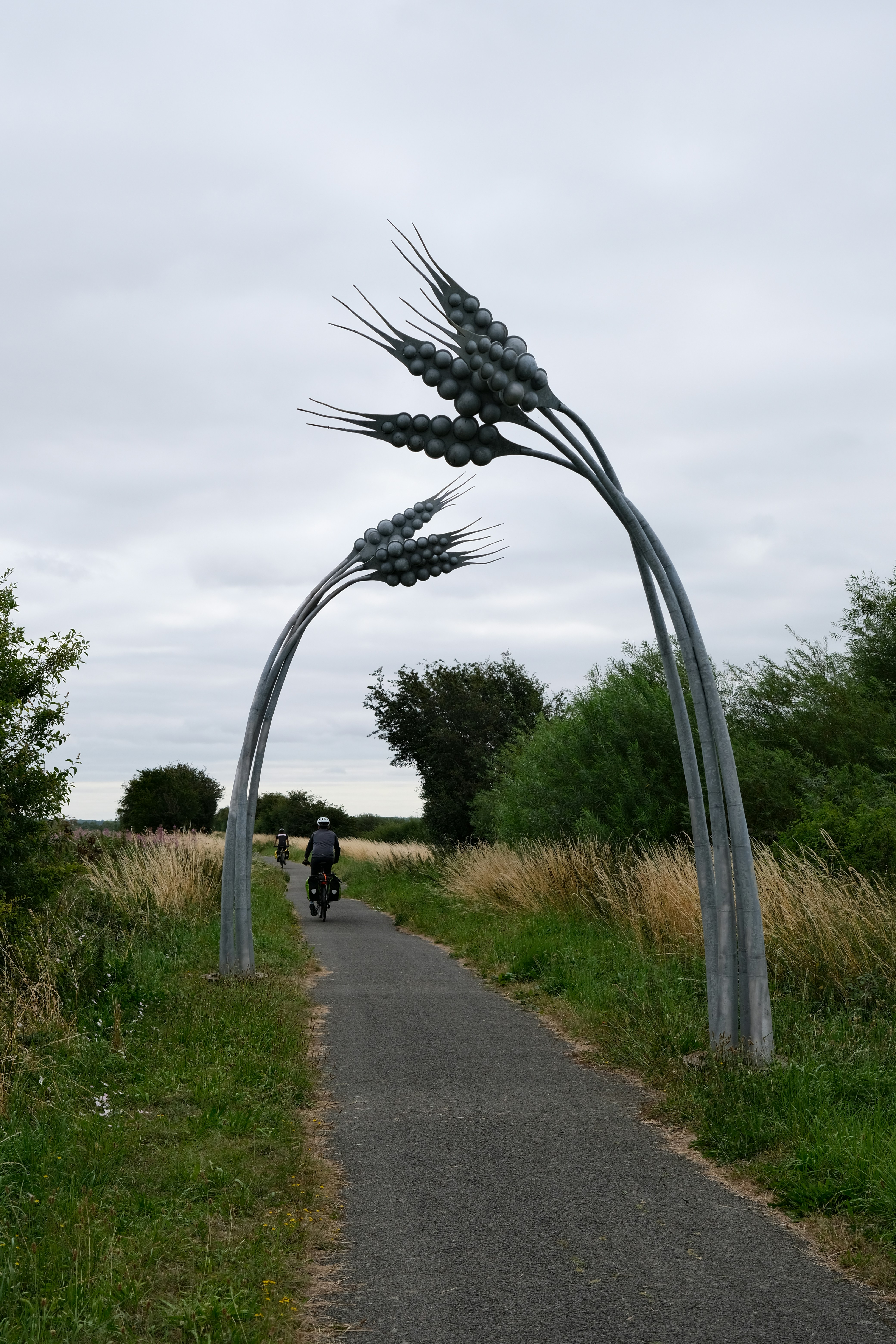 A person riding a bike down a path photo – Free Lincolnshire Image on ...