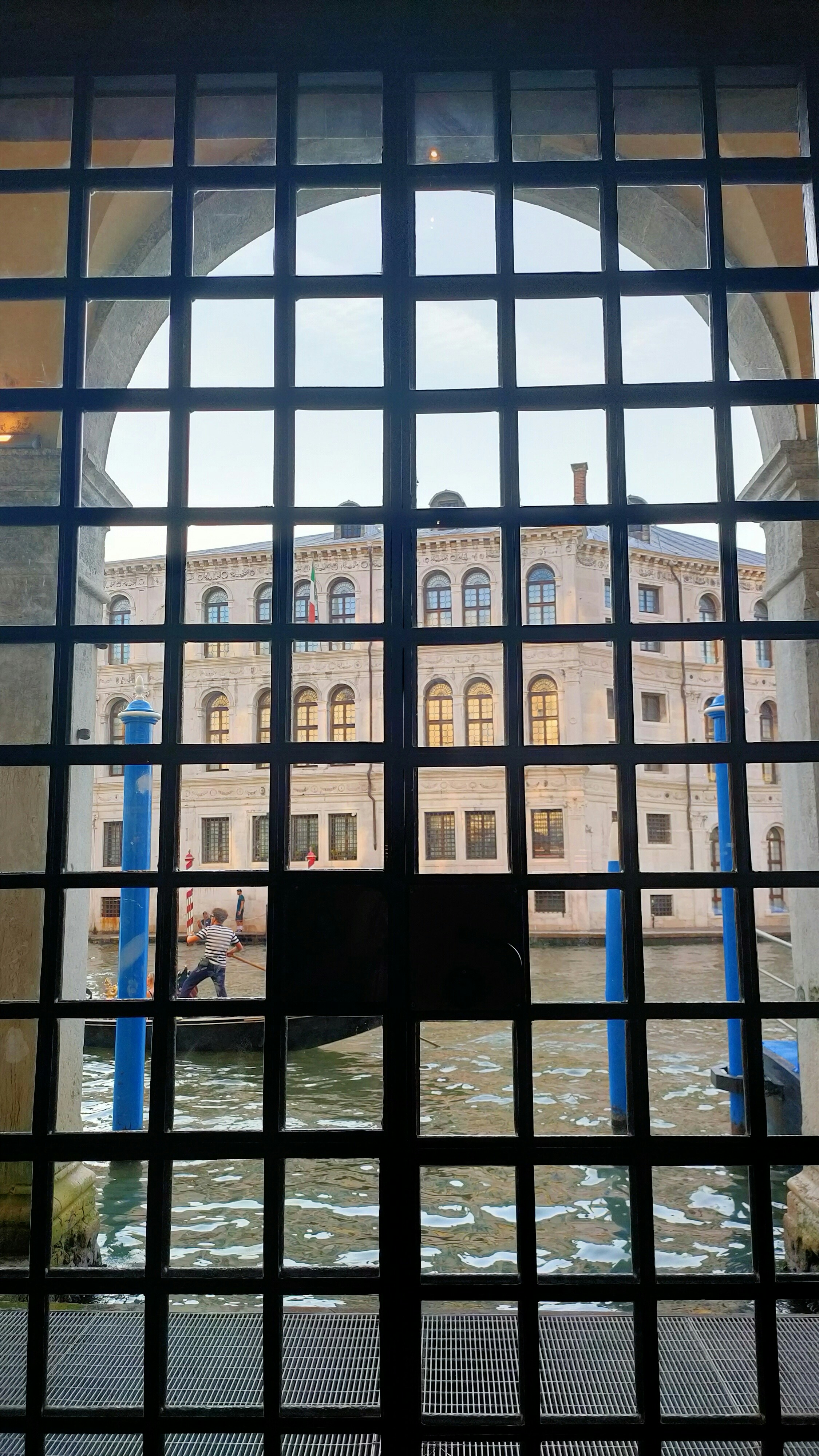 A view of a building through a window photo – Free Fontego dei tedeschi ...