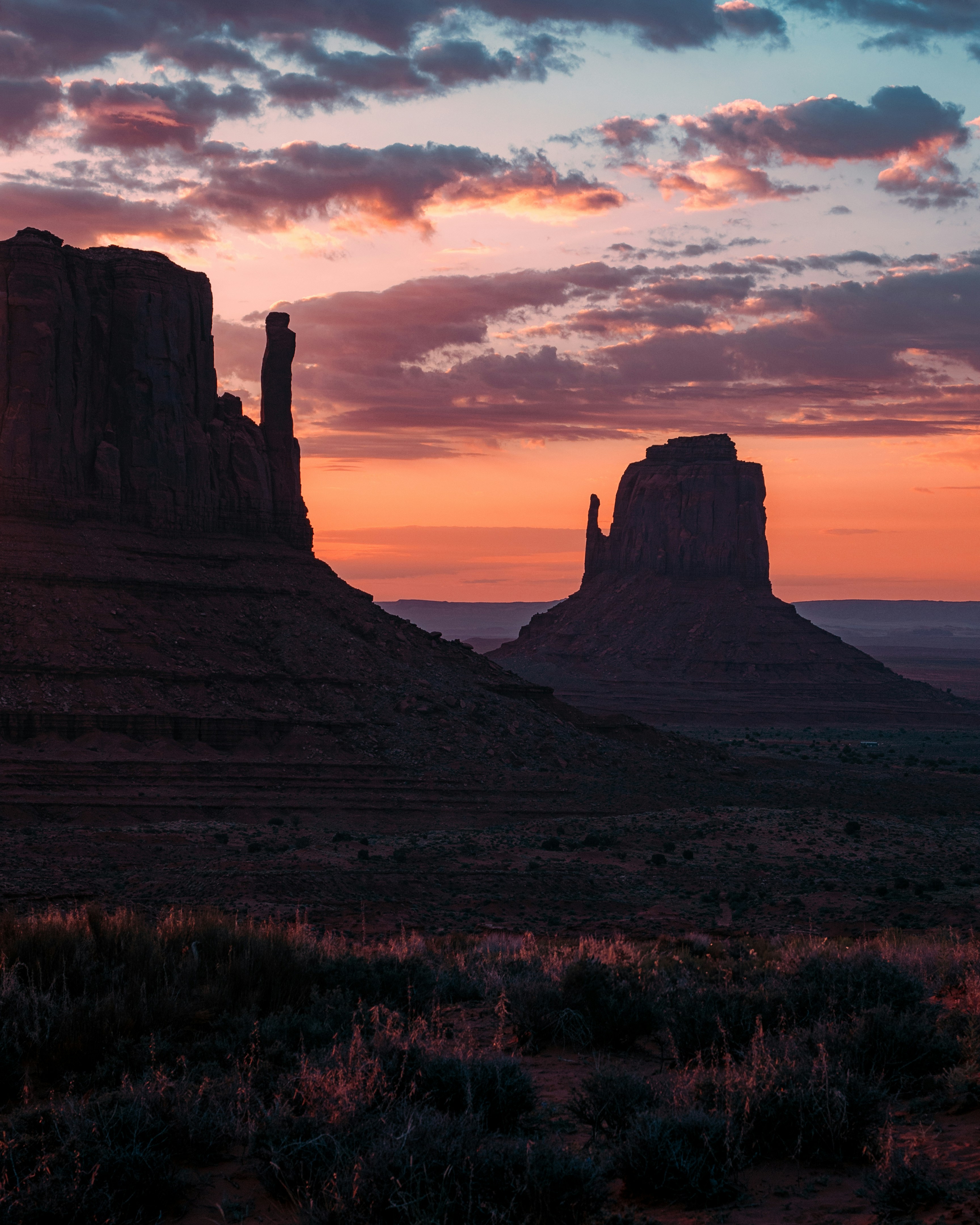 Crimson Monoliths at Dusk: Echoes of a Desert Skyline