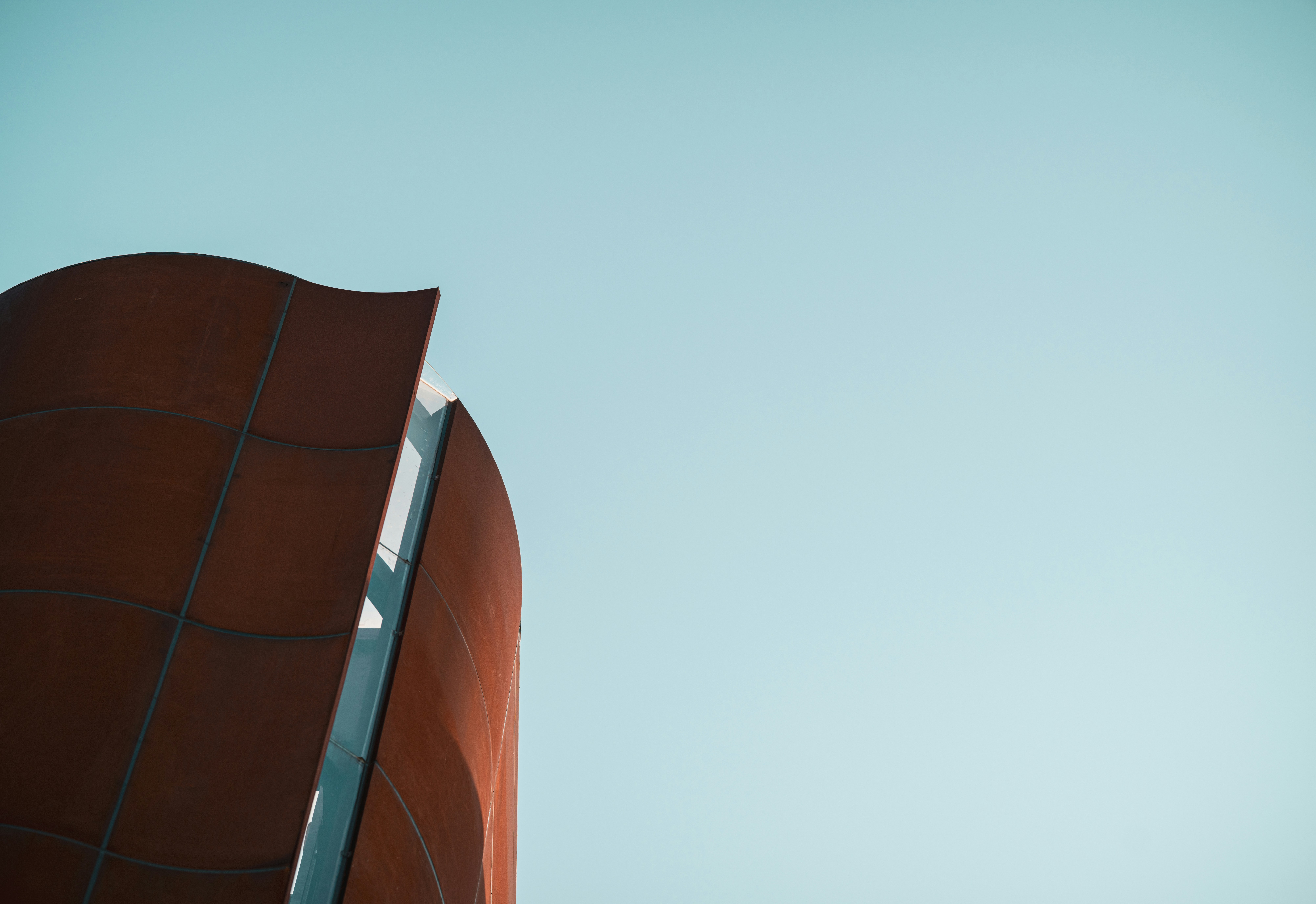 A tall building with a sky in the background