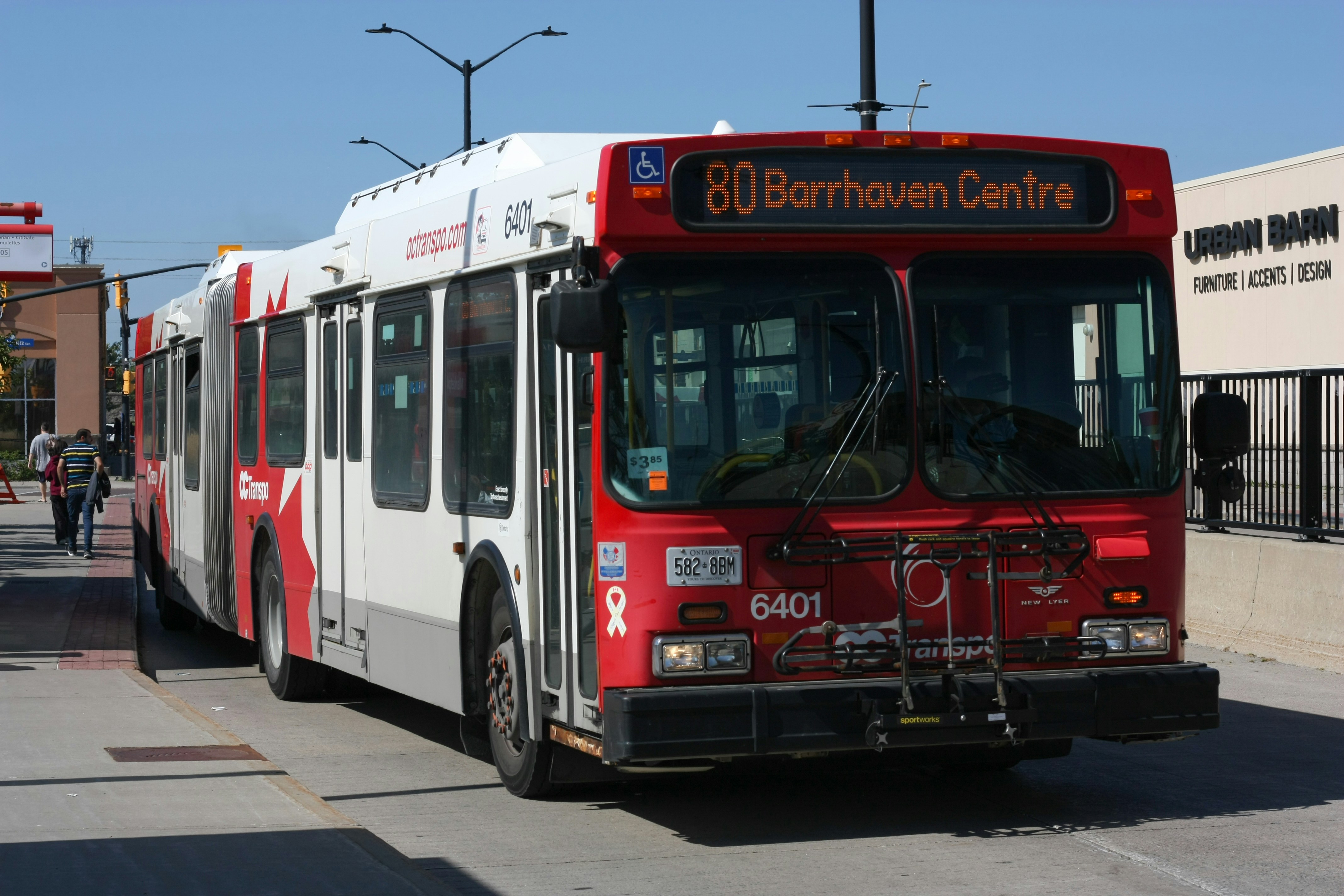 Route 80 in Focus: A Red-and-White City Bus at the Terminal