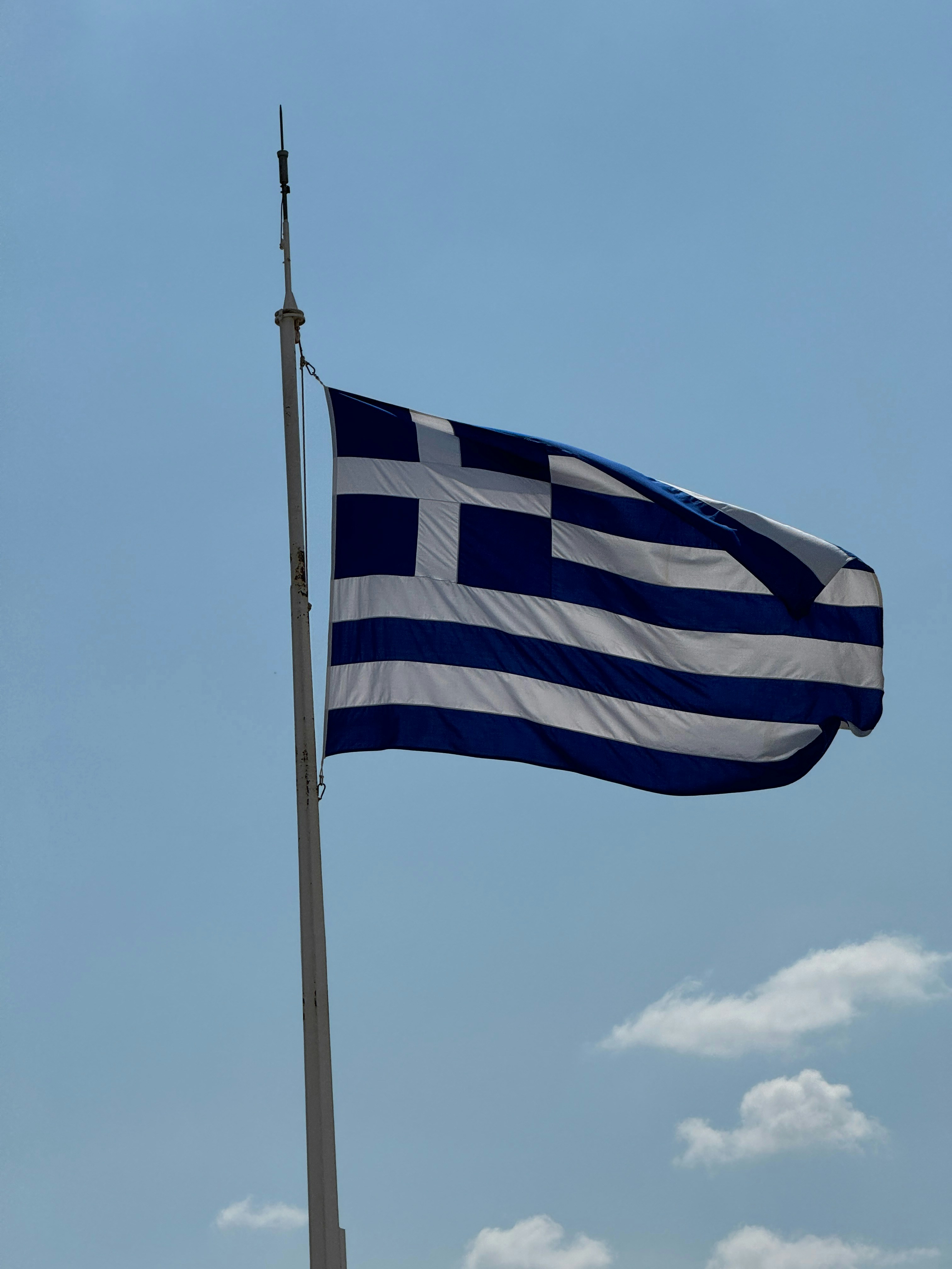 A large greek flag flying in the wind photo – Free Blue Image on Unsplash