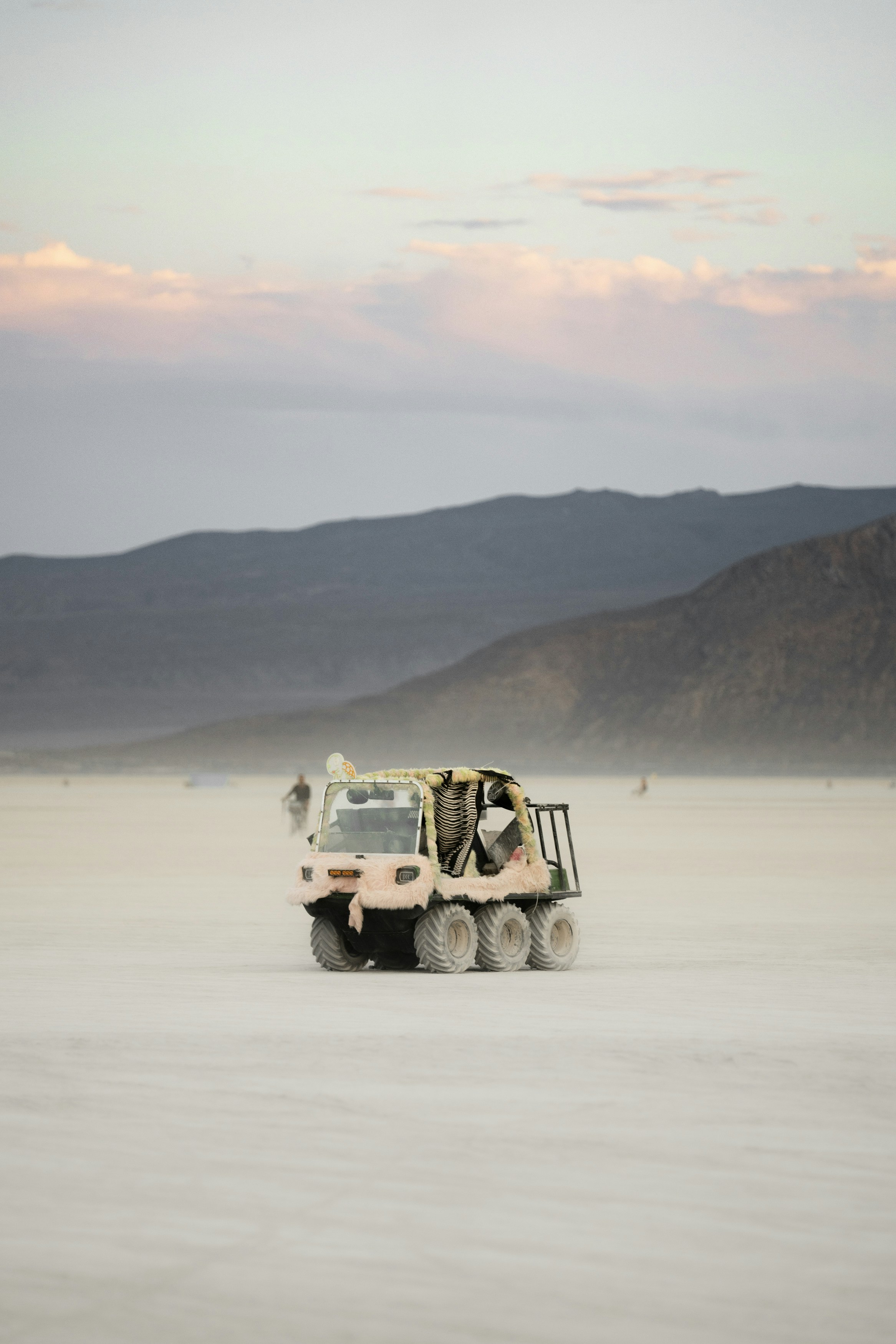 A large truck driving across a sandy field photo – Free Bikes Image on ...