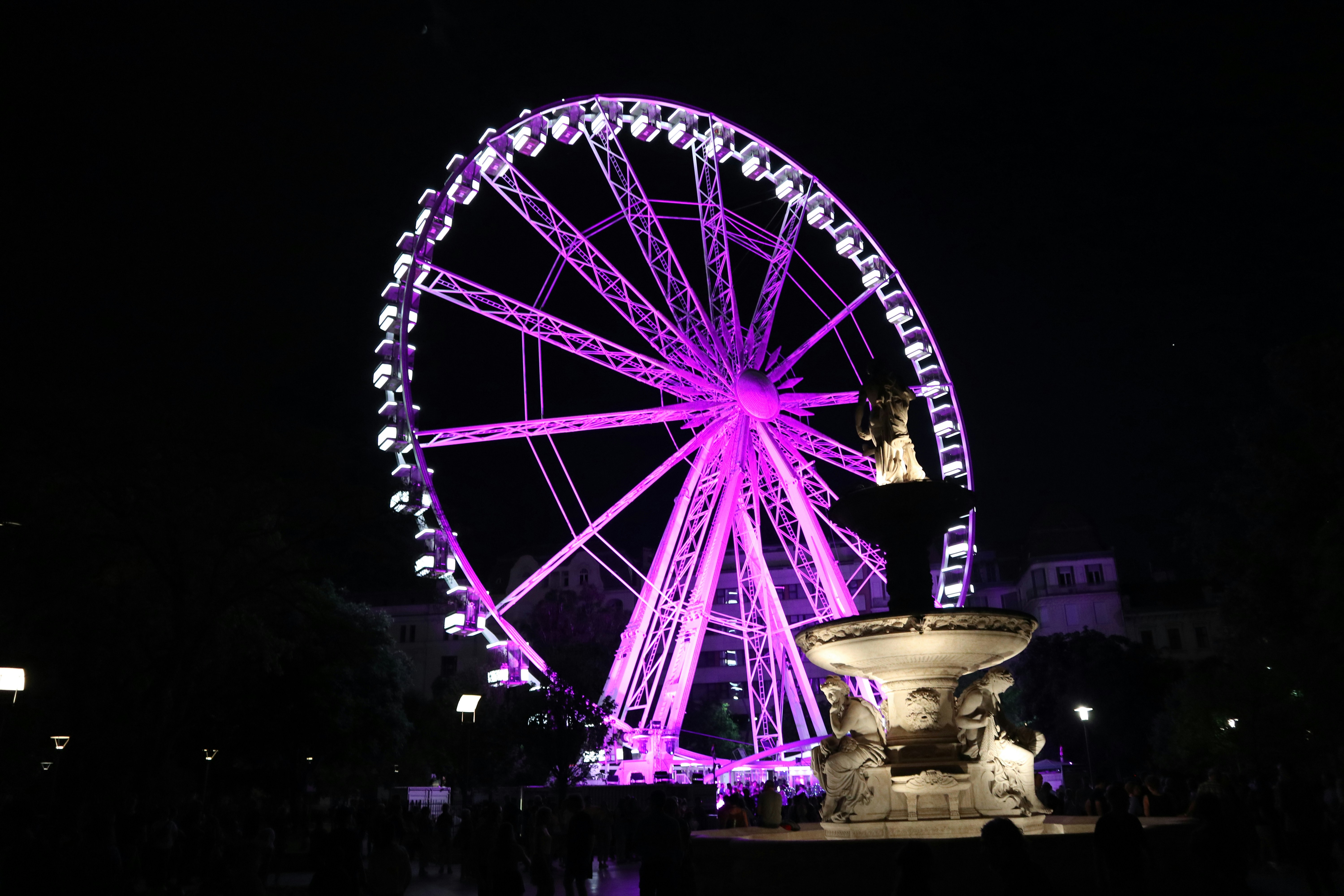 Purple Hour Over the Quiet Plaza: Neon Ferris Wheel at Night