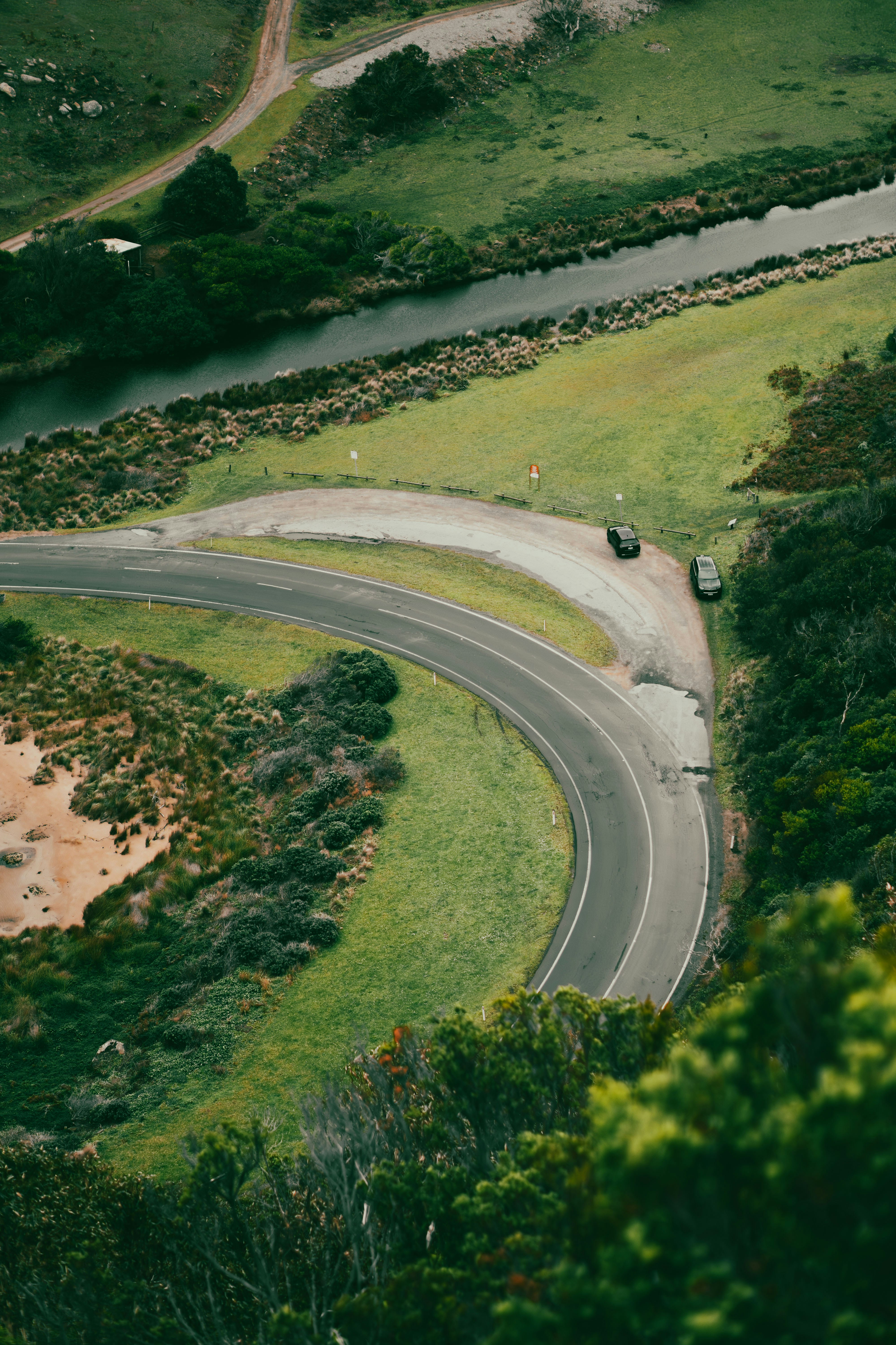Curling Curve over River Bend: An Aerial Portrait of Green Valleys and a Quiet Turn