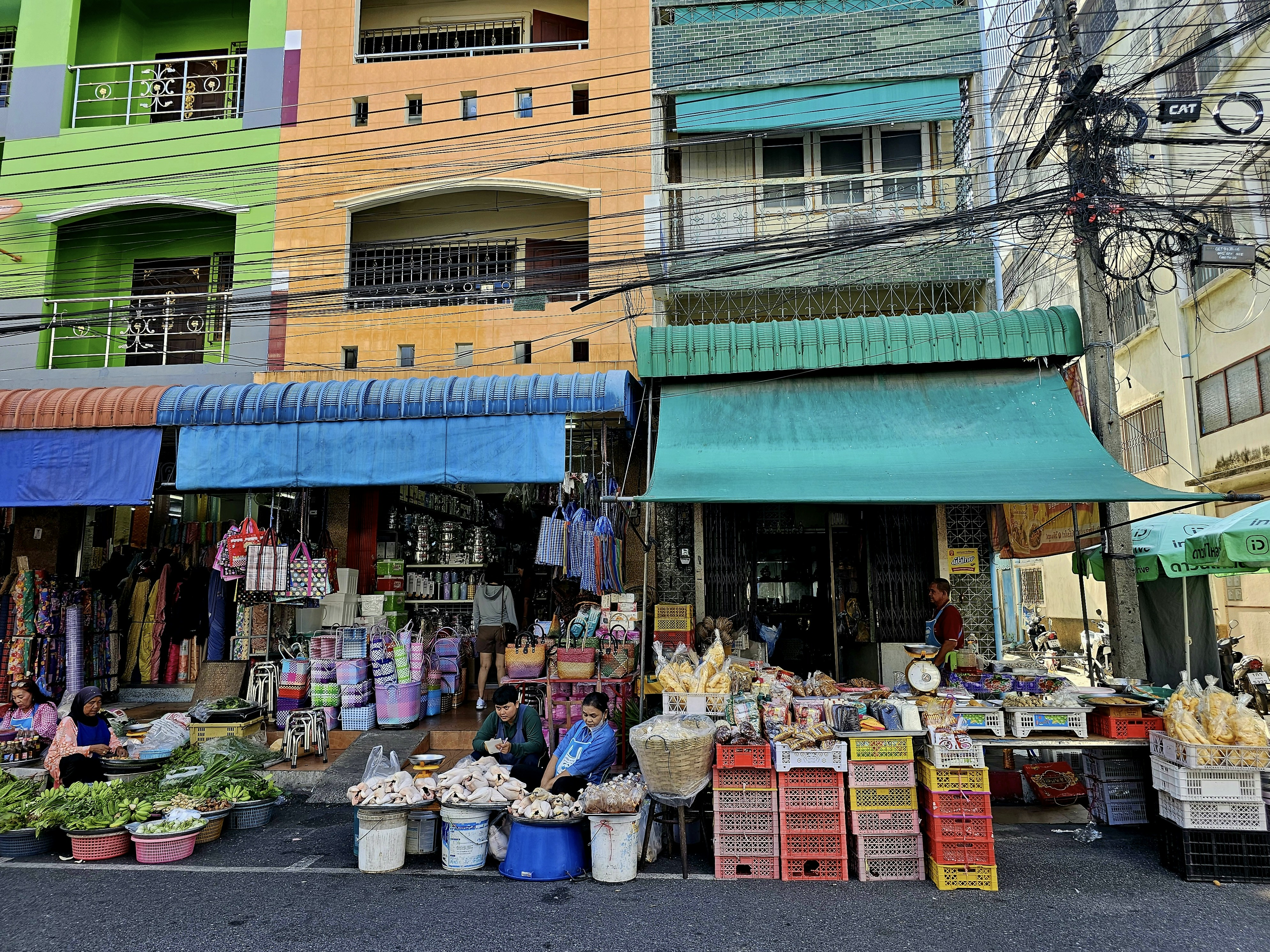 Market Palette: A Bustling Street Scene Beneath Rainbow Facades