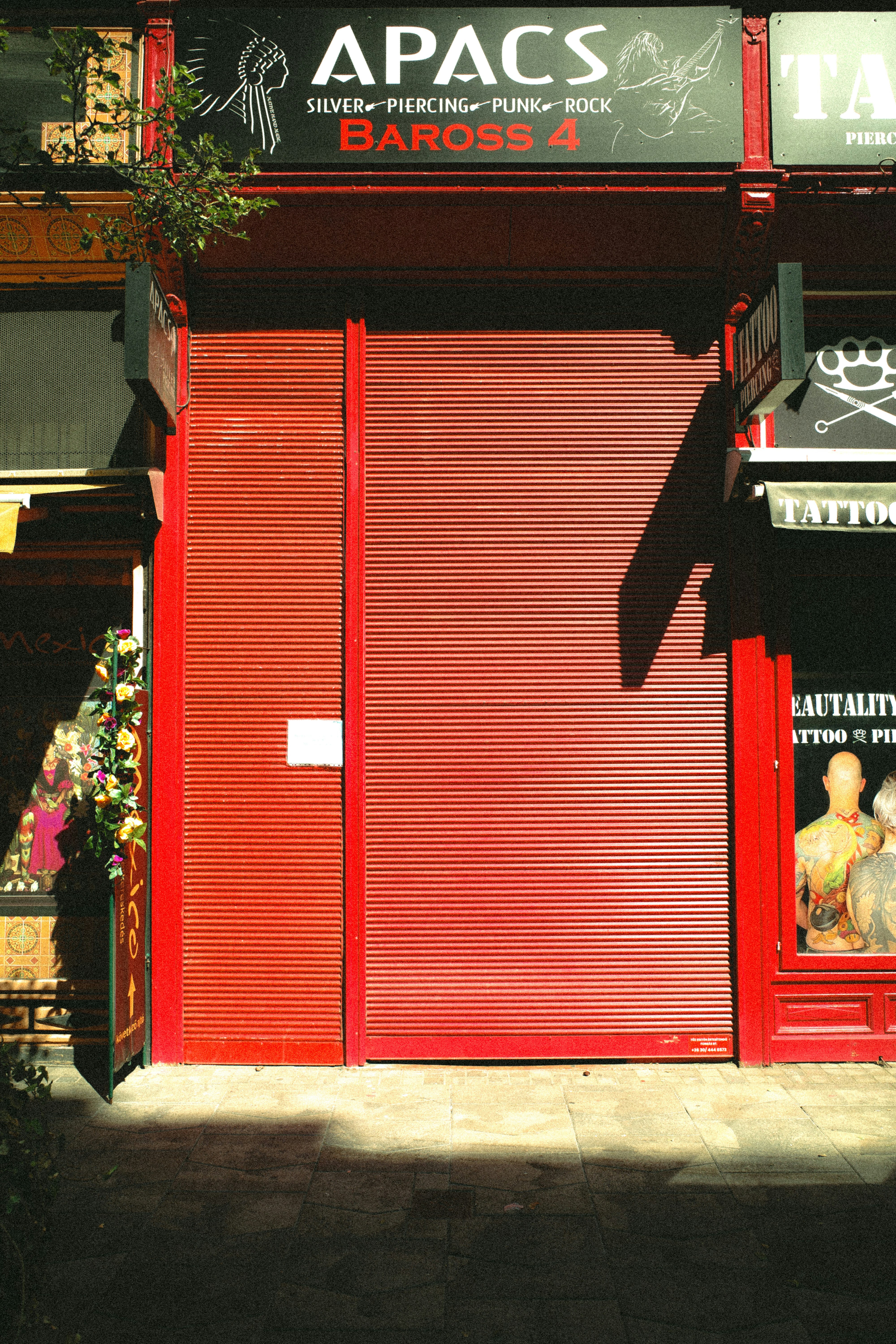 Baross 4's Crimson Gate: A Quiet Urban Shopfront
