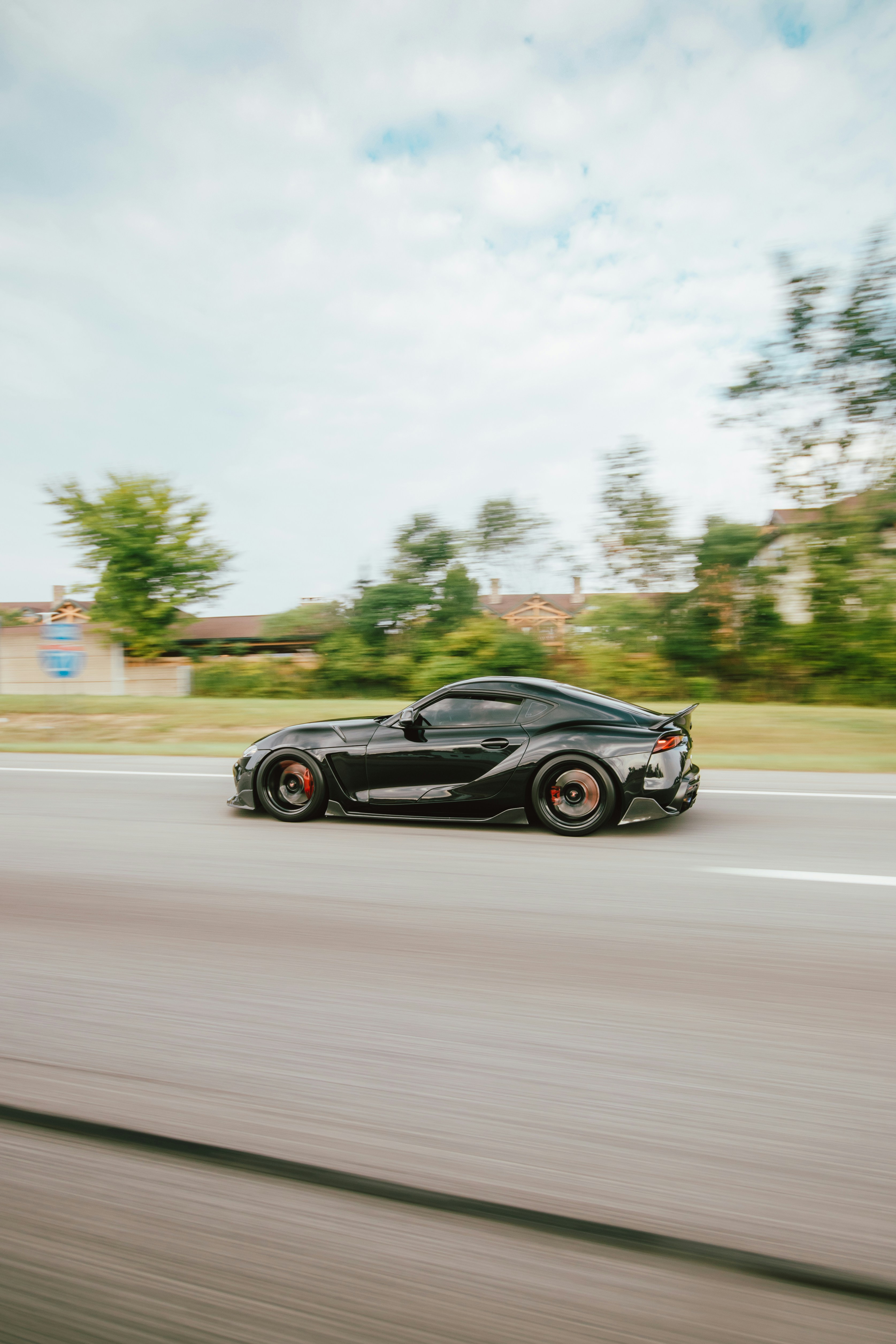 Midnight Hypercar in a Blur on the Highway