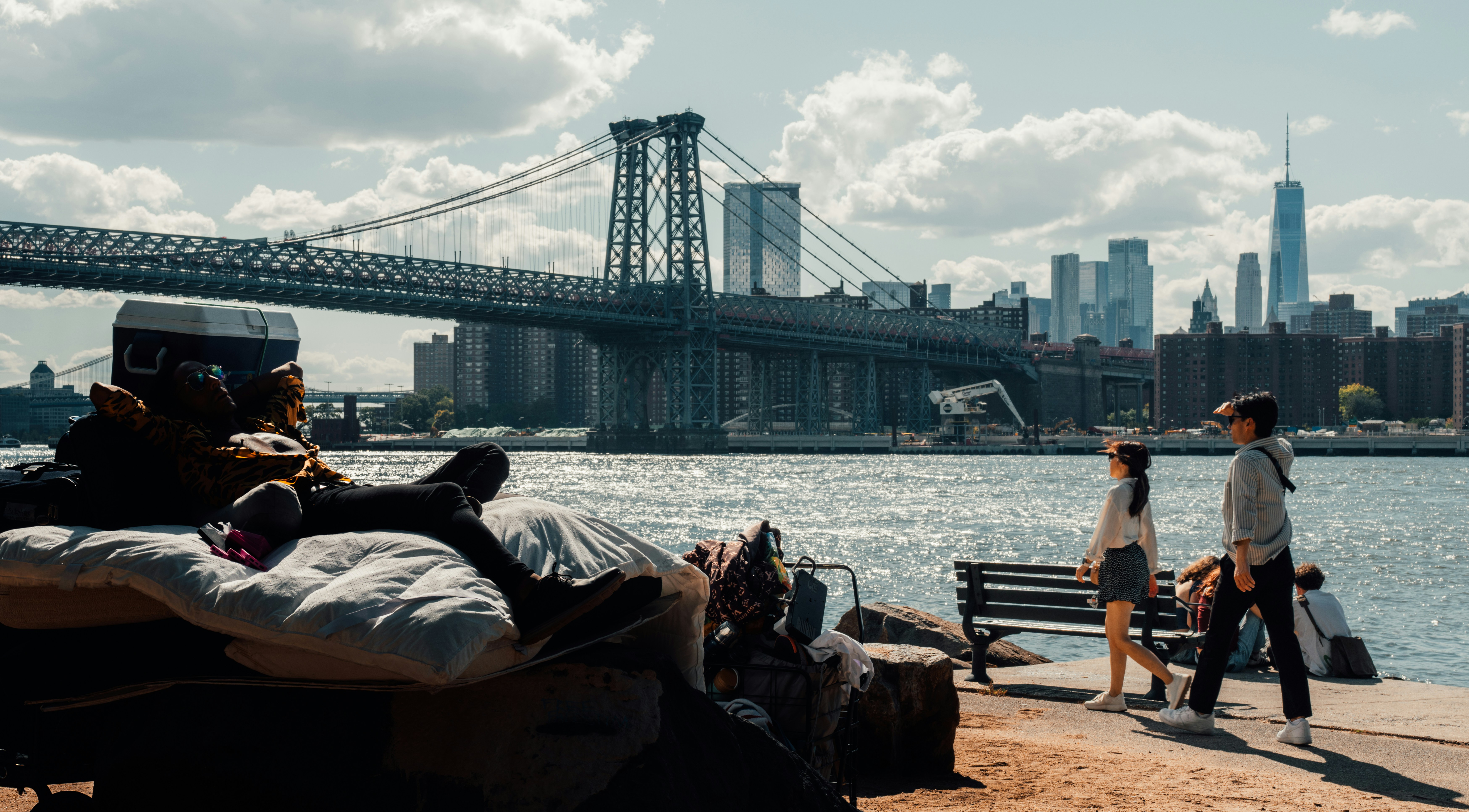 Bridgefront Calm: Cushions, Pedestrians, and the NYC Skyline