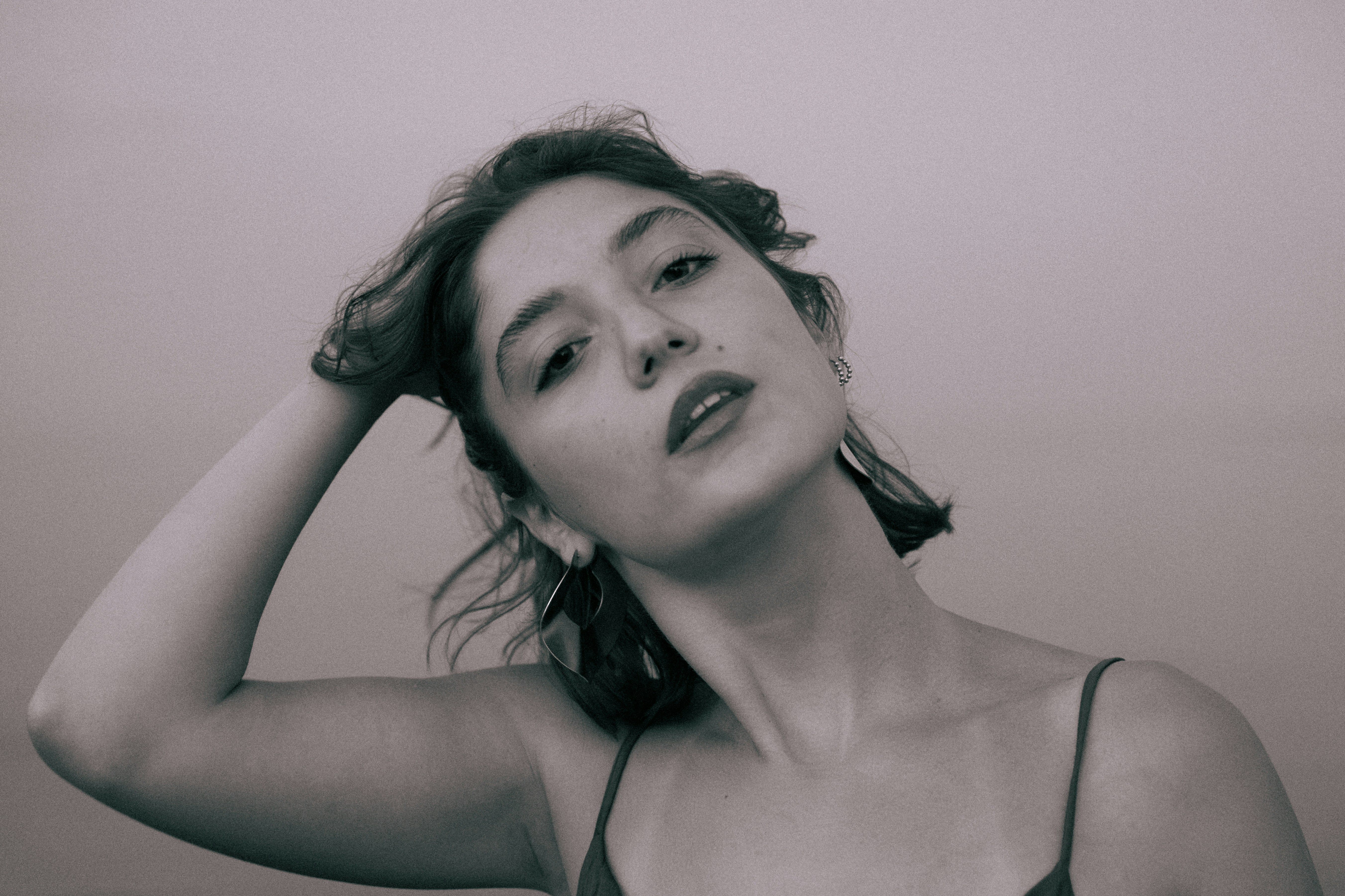 A black and white photo of a woman in a bra photo – Free Face Image on ...