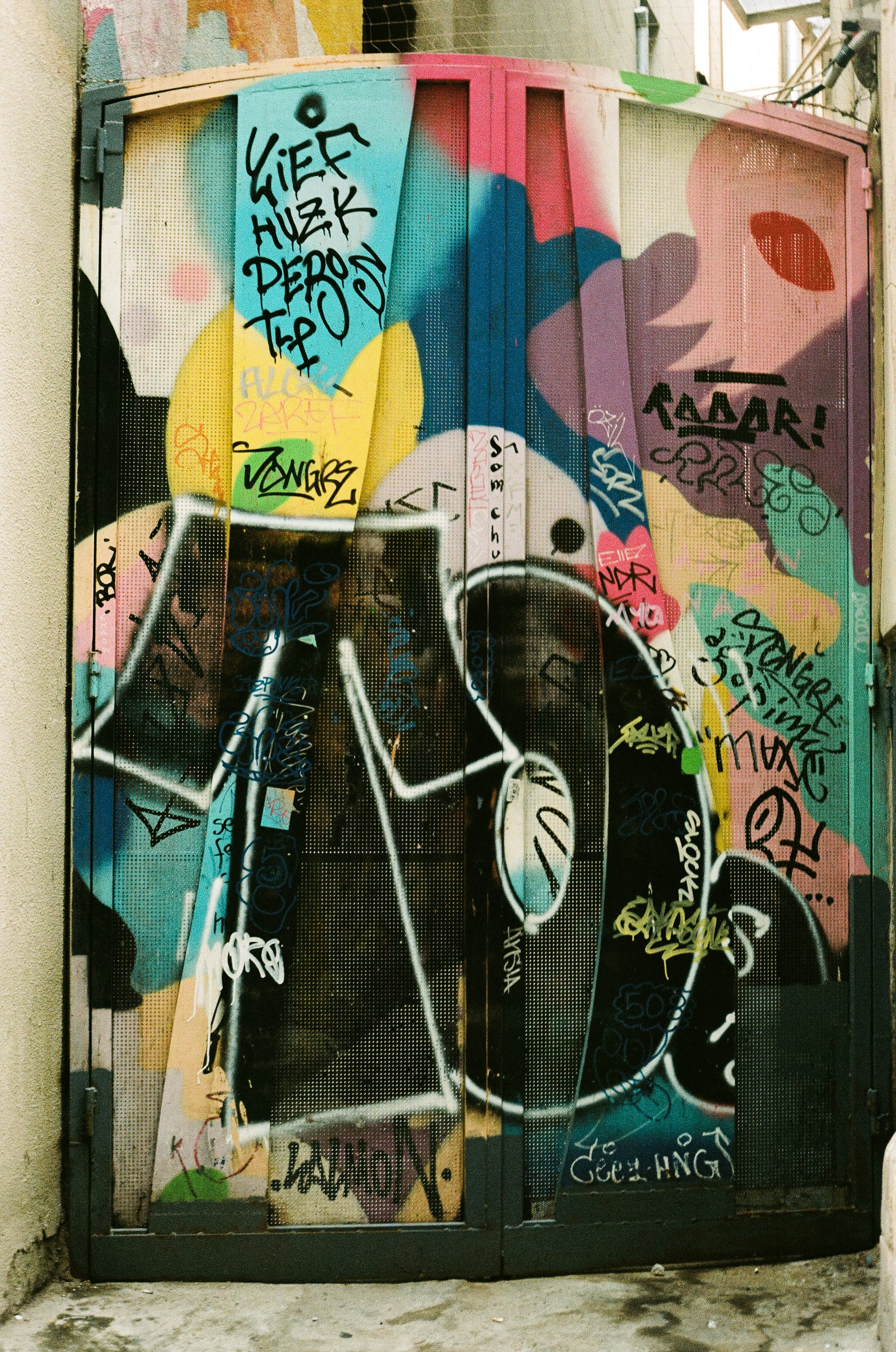 A door with a bunch of graffiti on it photo – Free Spain Image on Unsplash