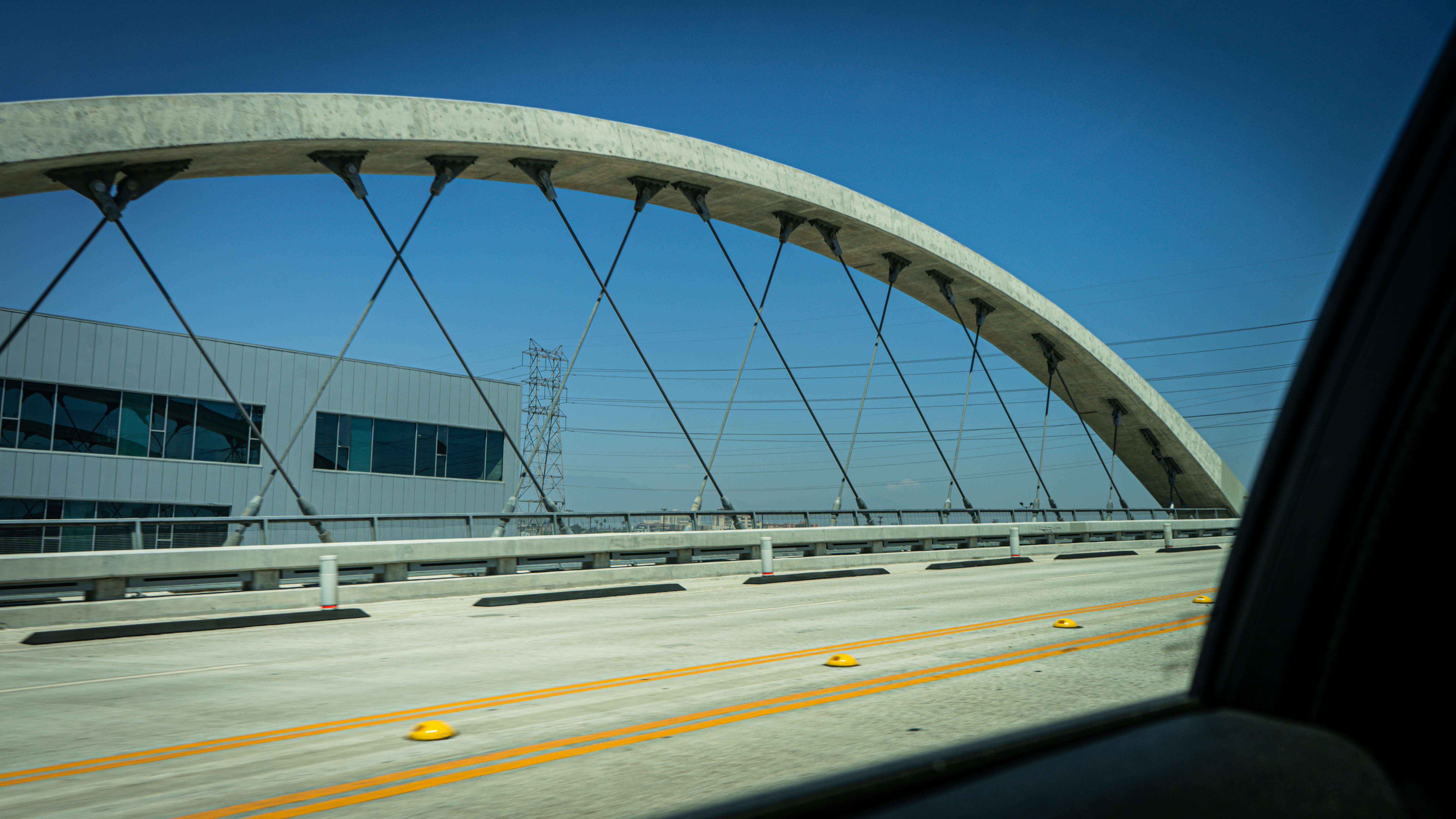 A view of a bridge from inside a car photo – Free Downtown Image on ...
