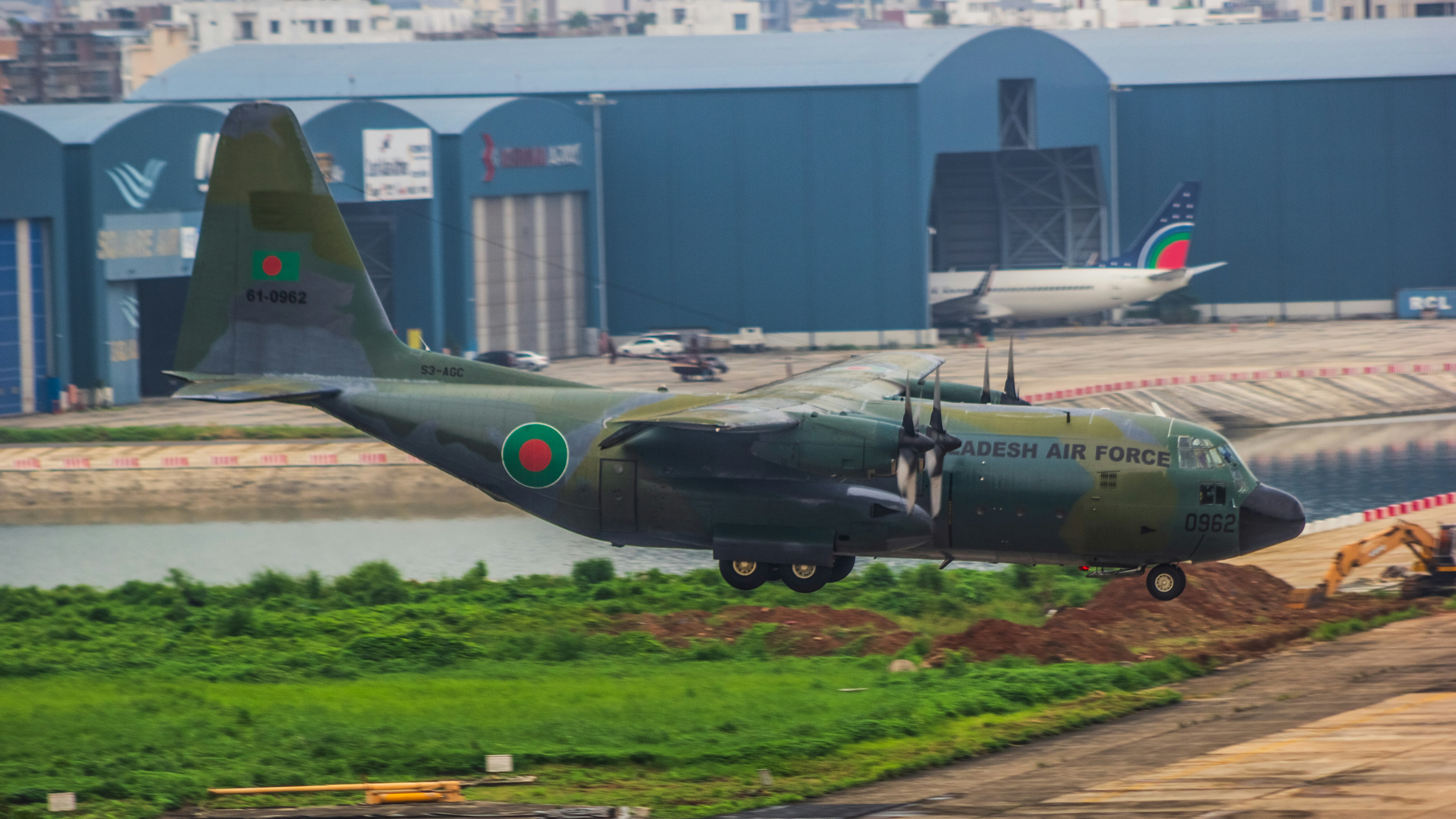 Green Mirage: A Bangladesh Air Force C-130 on a sunlit taxiway