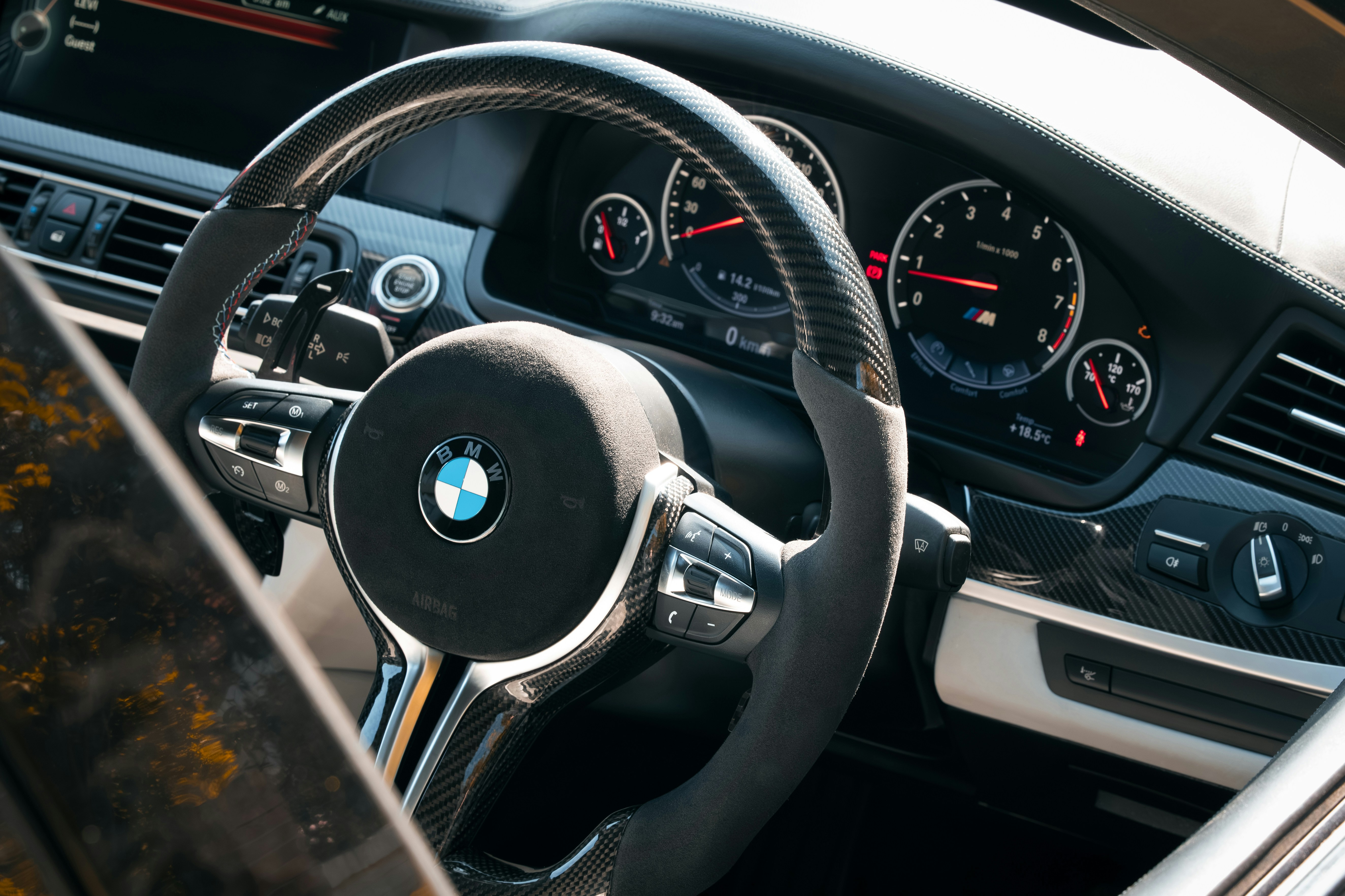 The interior of a car with a steering wheel and dashboard photo – Free ...