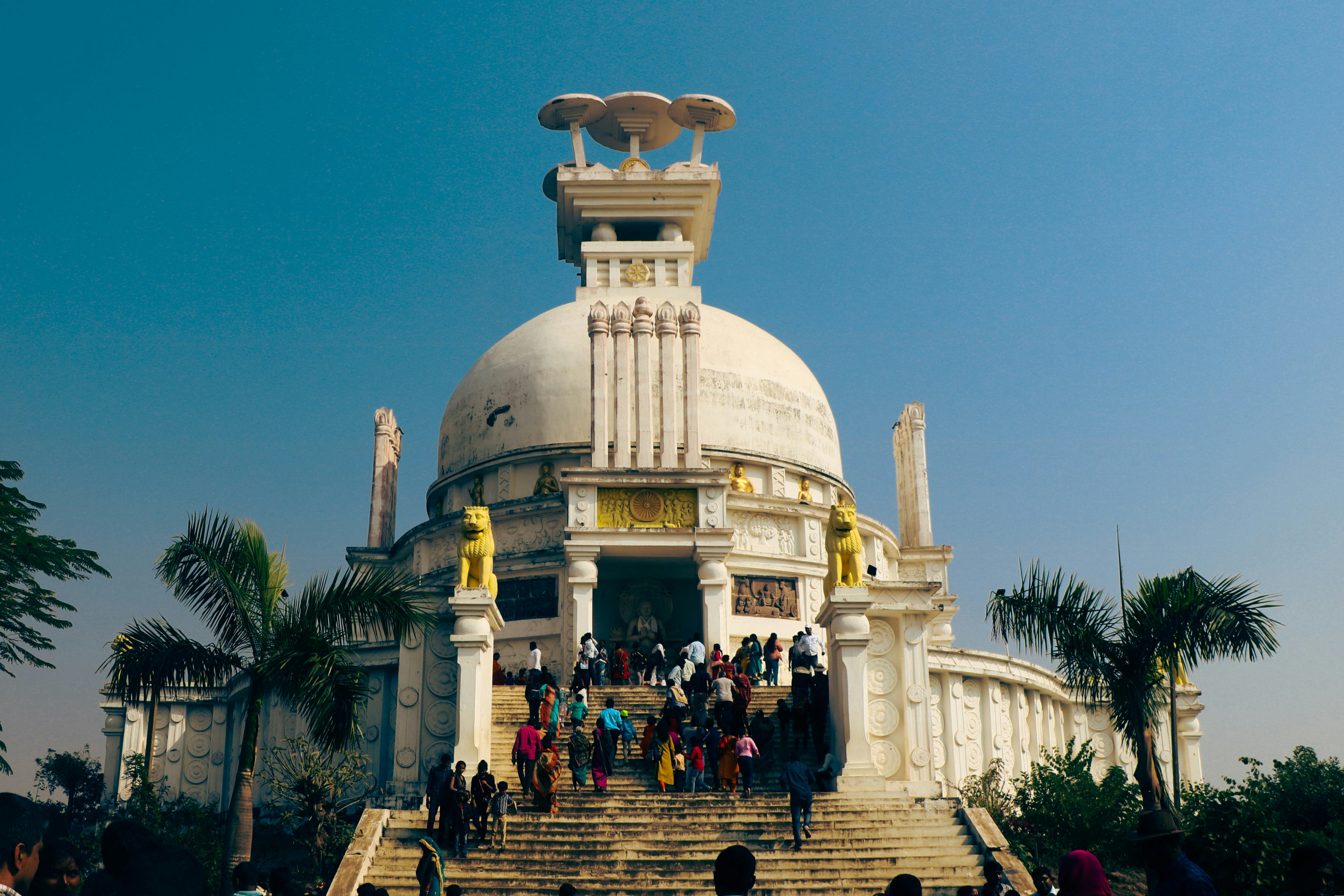 A group of people standing outside of a building photo – Free Odisha ...