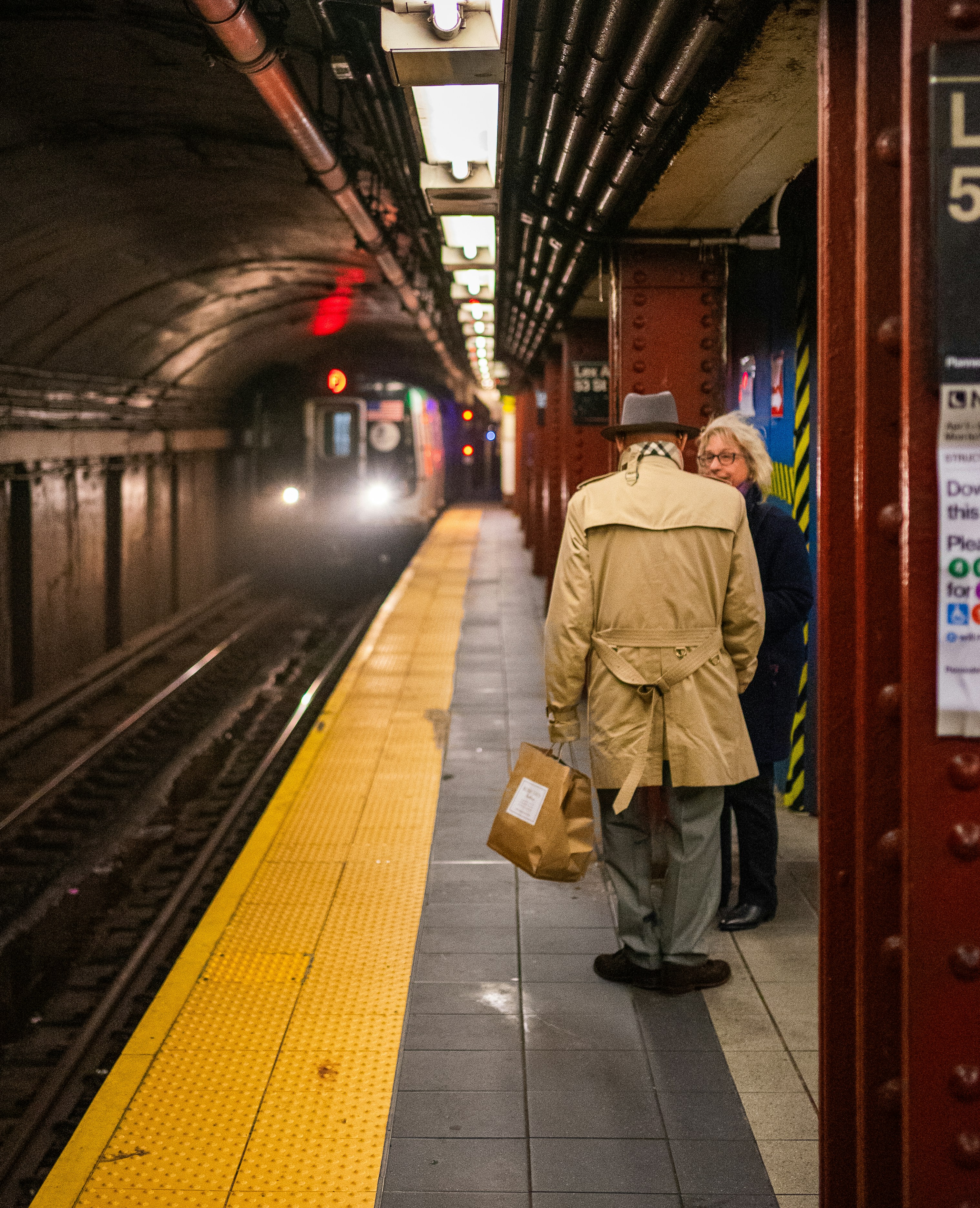 A man in a trench coat waiting for a train photo – Free Subway Image on ...
