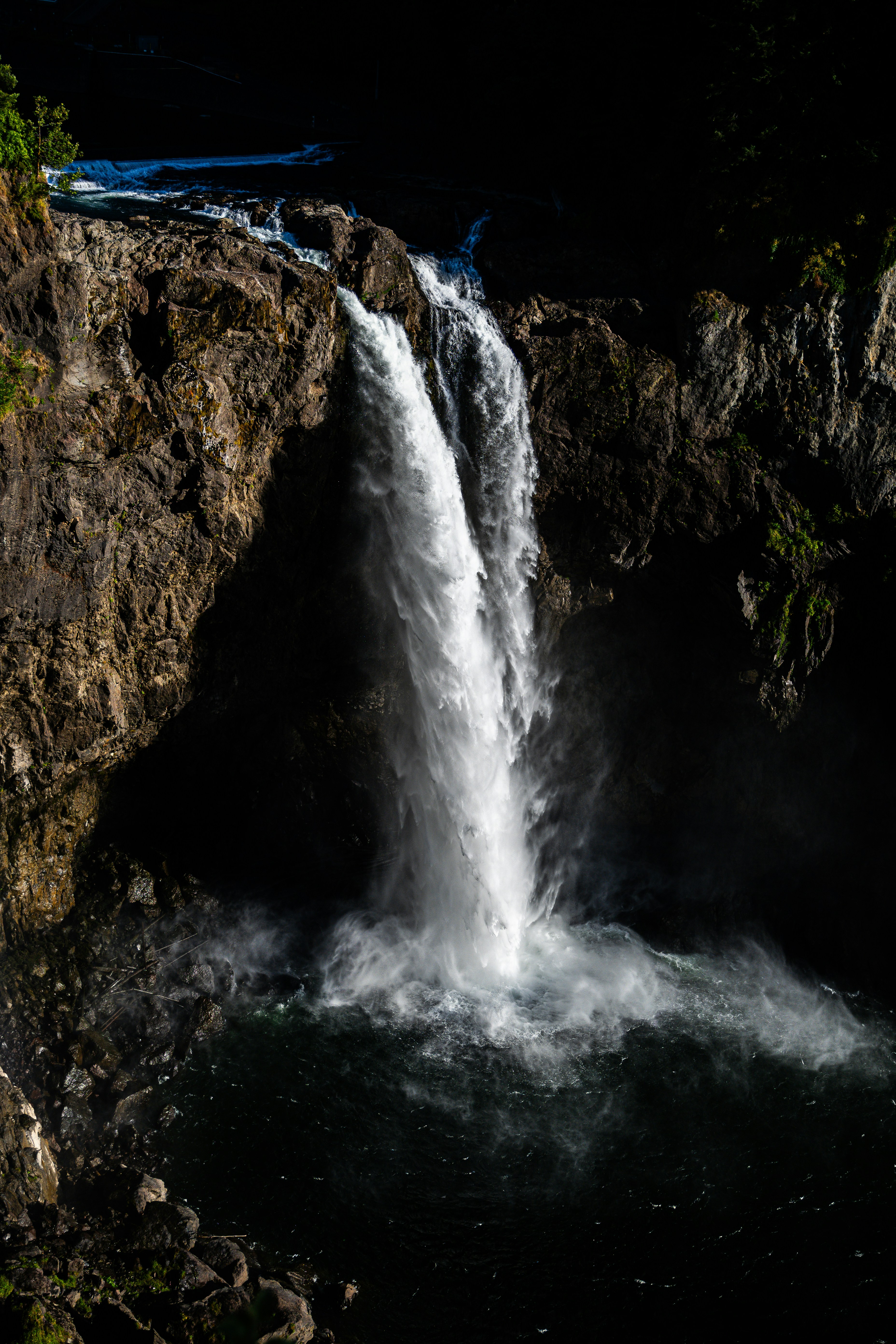 Snoqualmie Falls Washington | A large waterfall with water coming out of it