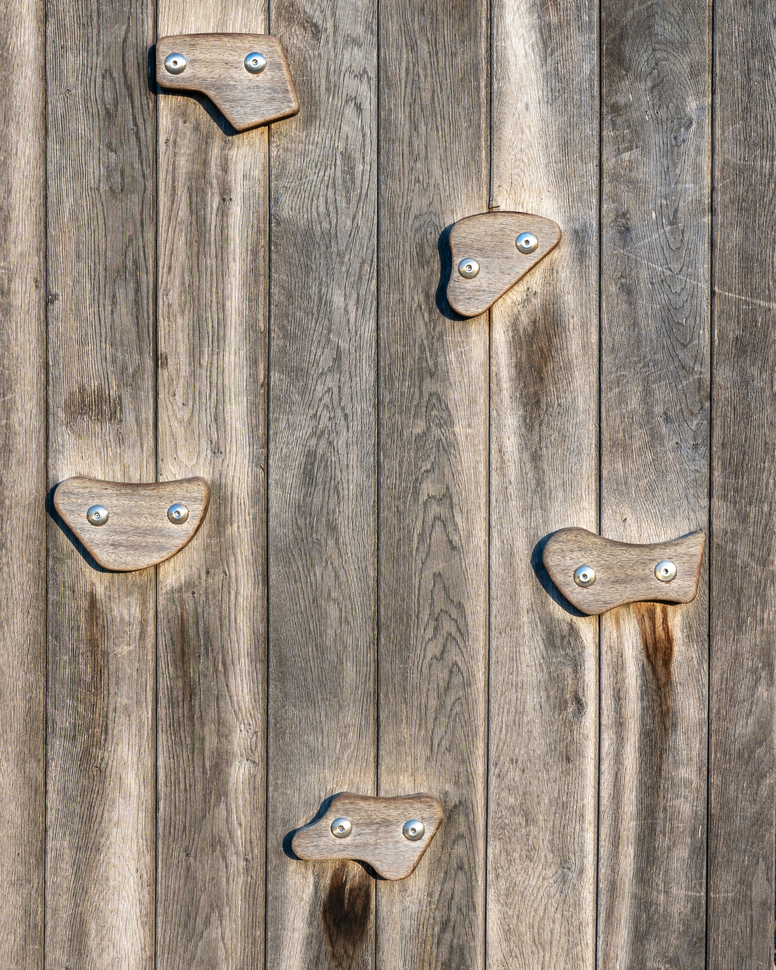 Tangram of Weathered Wood: Irregular Brackets on a Sunlit Fence