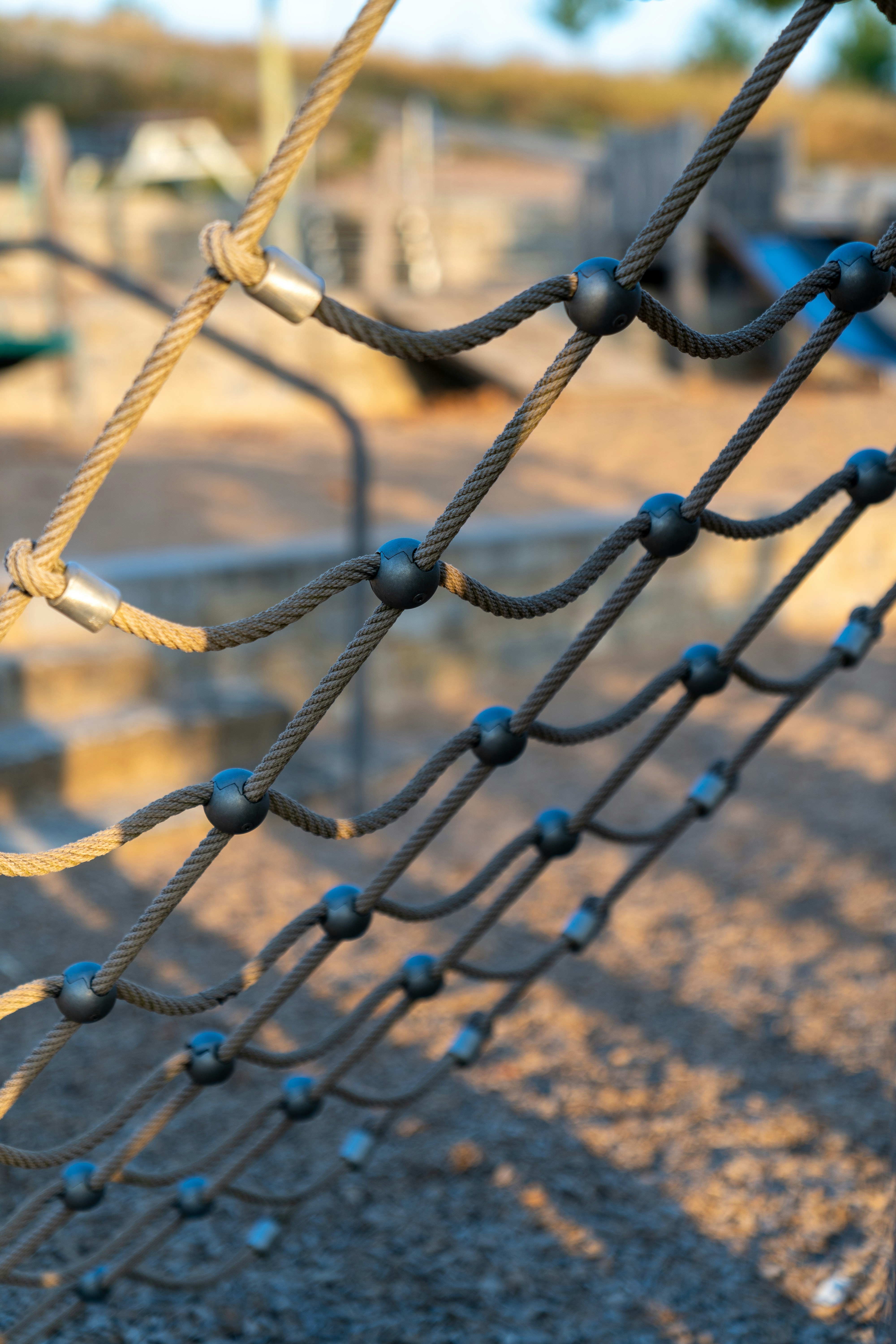 Knotwork in the Sun: Close-Up of a Playground Rope Mesh