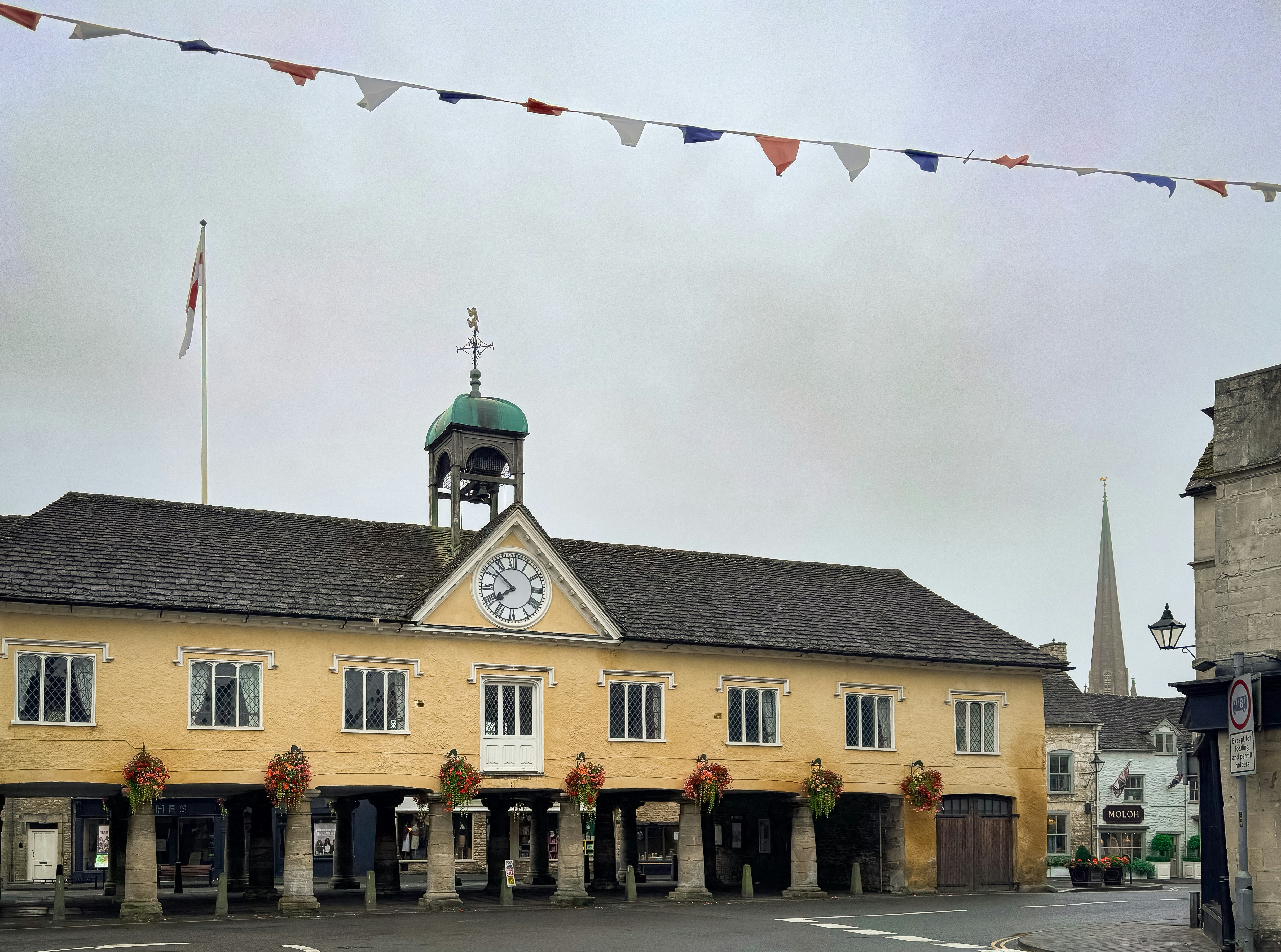 Clock Tower in Festive Light: A Town Square Moment