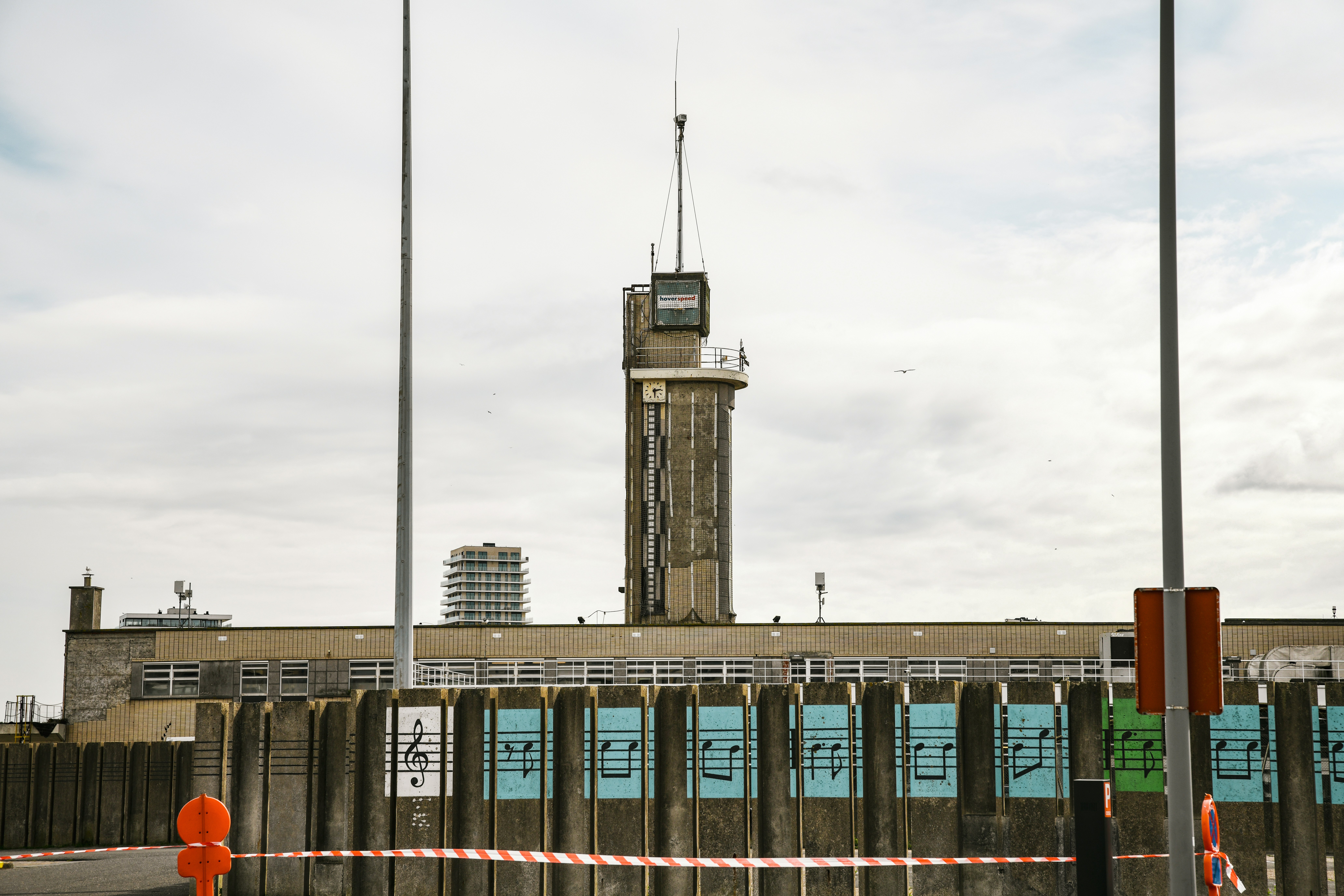 A train station with a clock tower in the background photo – Free ...