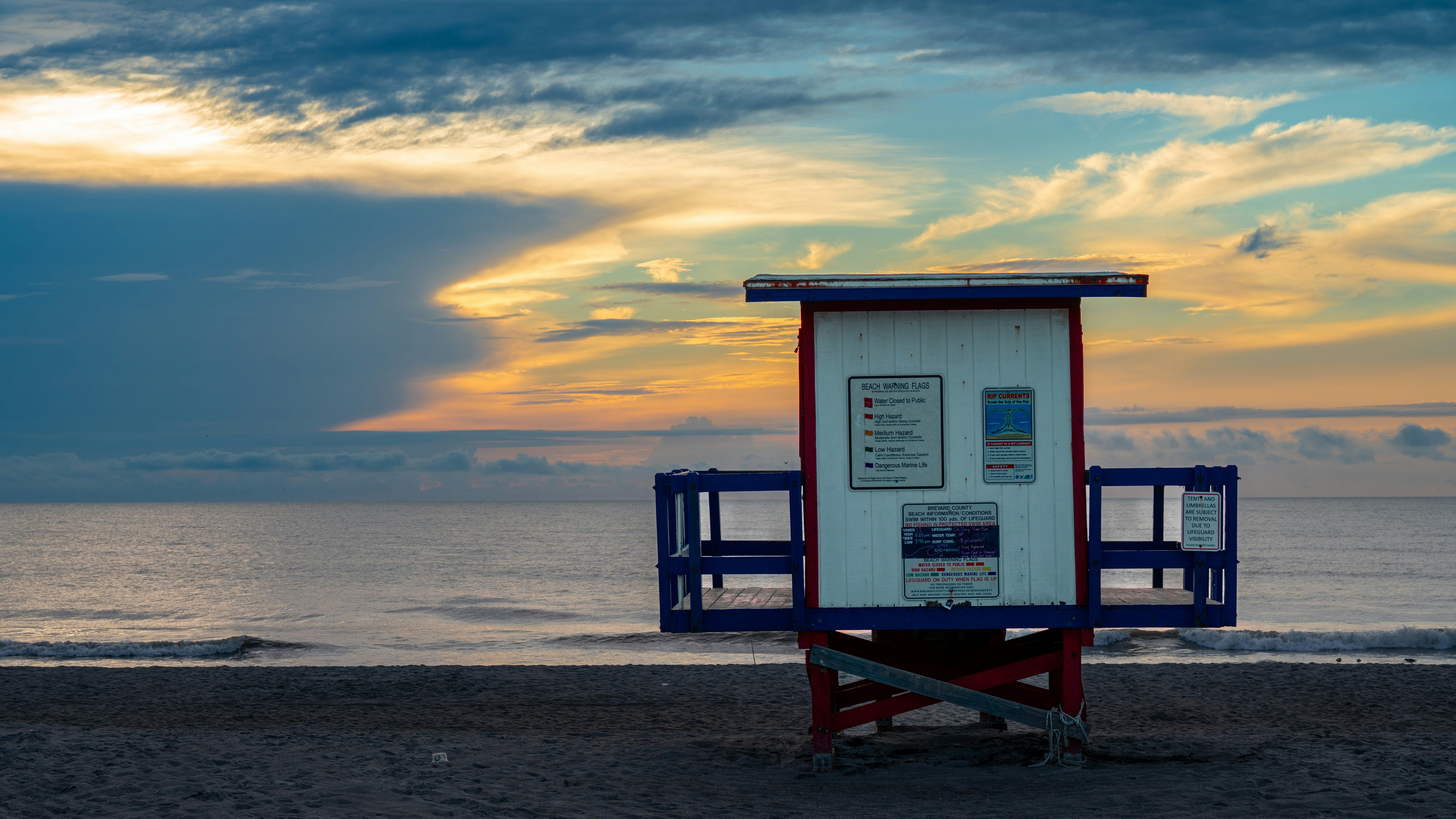 A lifeguard stand on the beach at sunset photo – Free Beach Image on ...