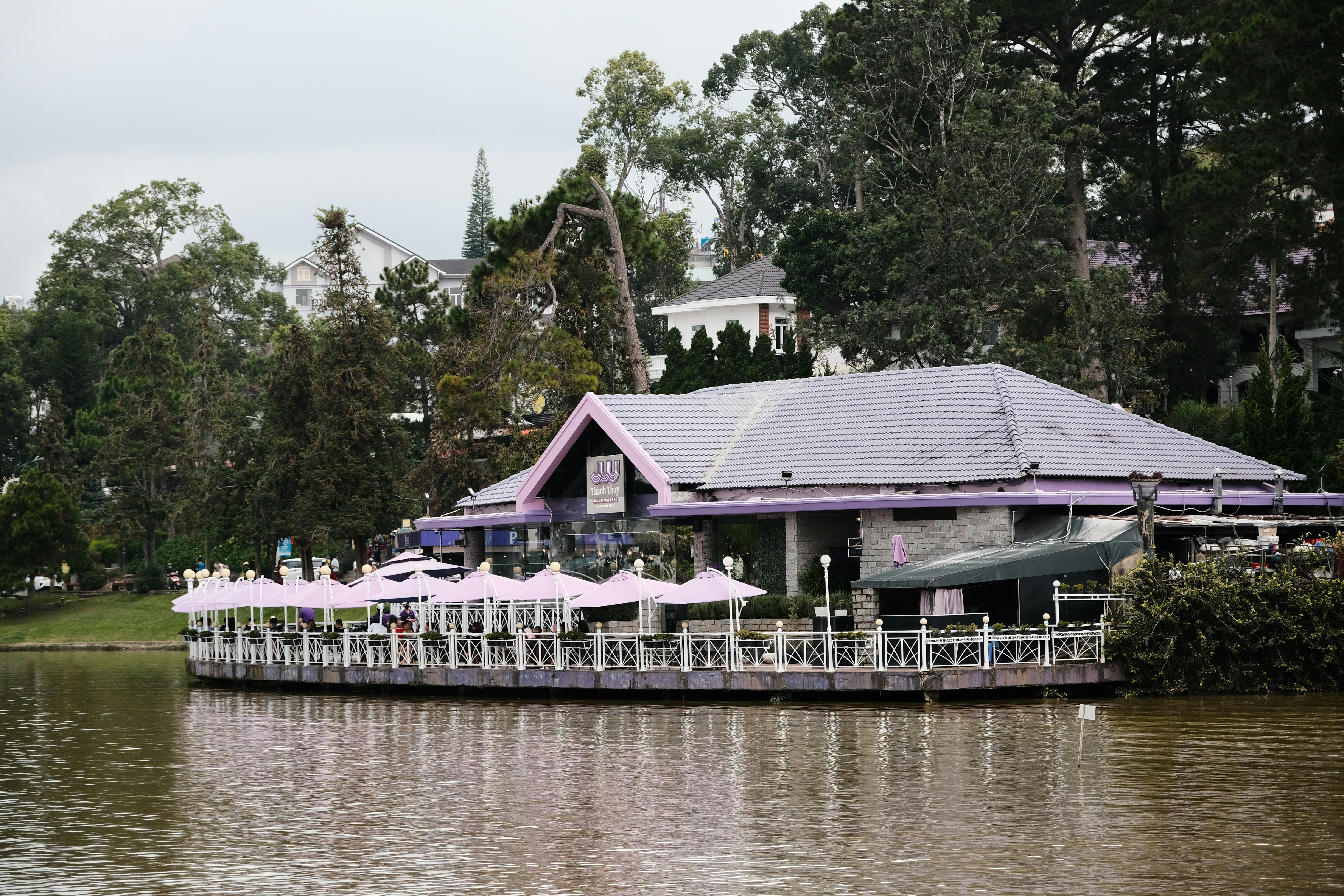 Purple-roofed Riverside Pavilion: Dining Deck Over a Tranquil Lake