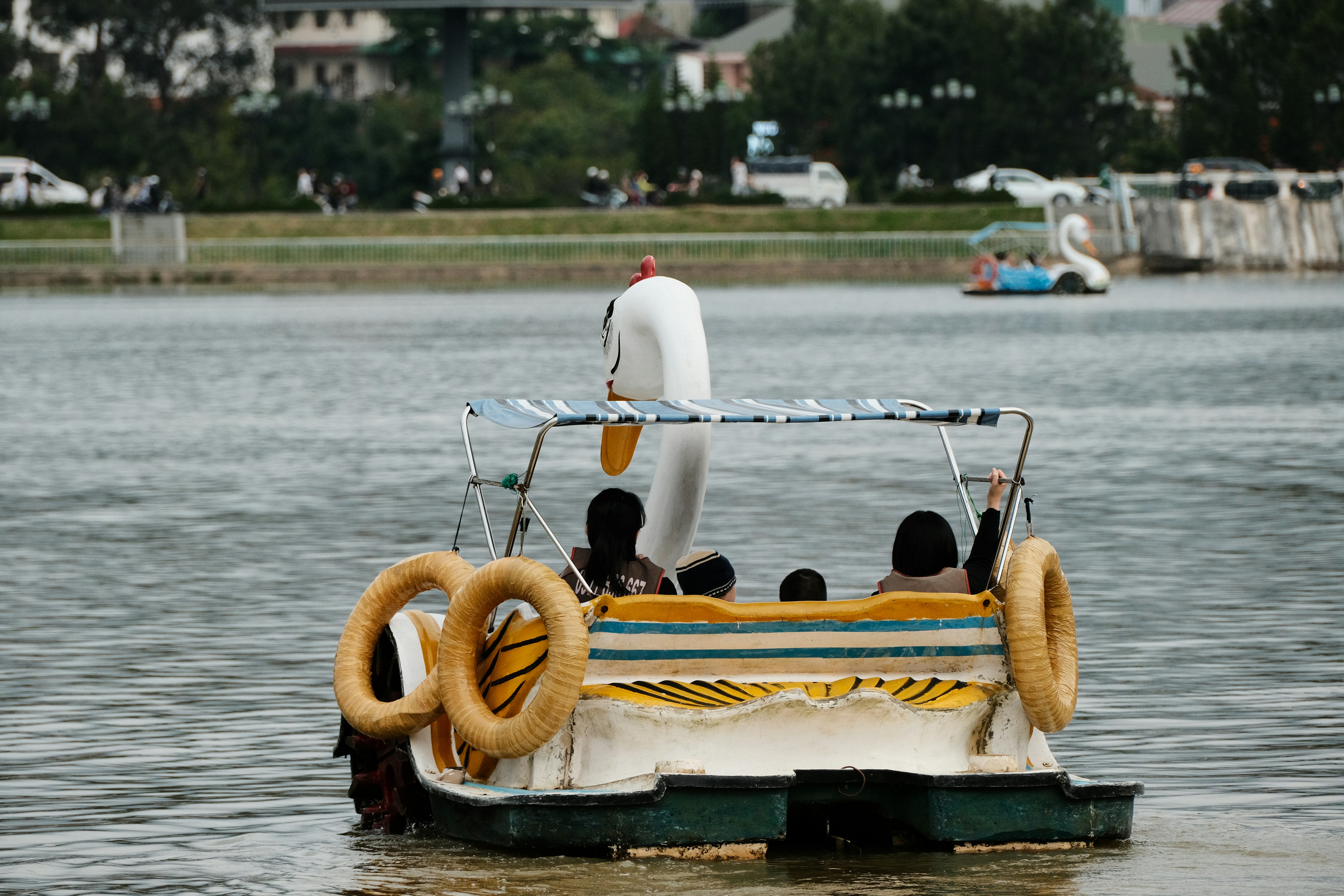 Circles and Stripes Afloat: A Quiet Lake Pedal-Boat Moment